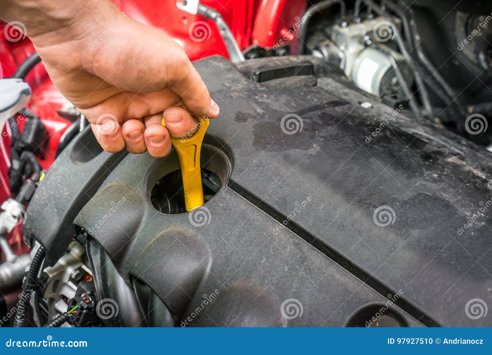 Mechanic Checking the Oil Level in a Car Engine Stock Photo - Image of ...