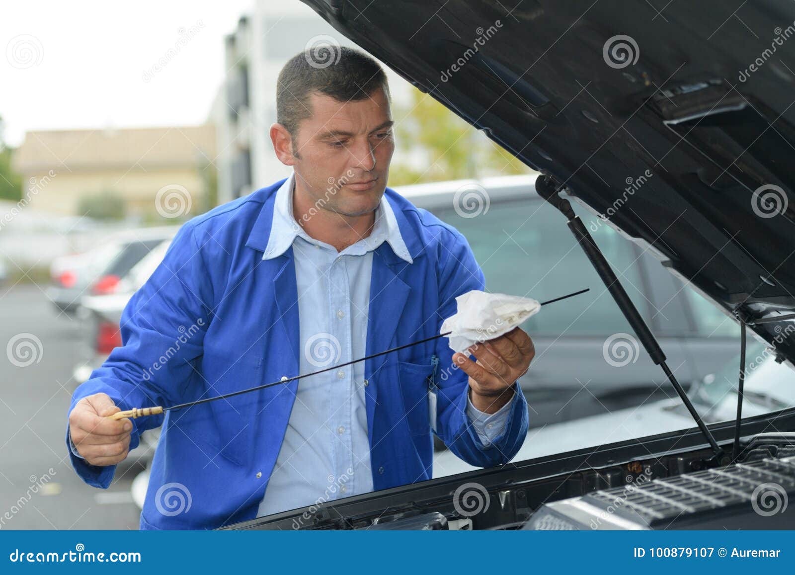 Mechanic Checking Oil Level in Car Workshop Stock Image - Image of ...