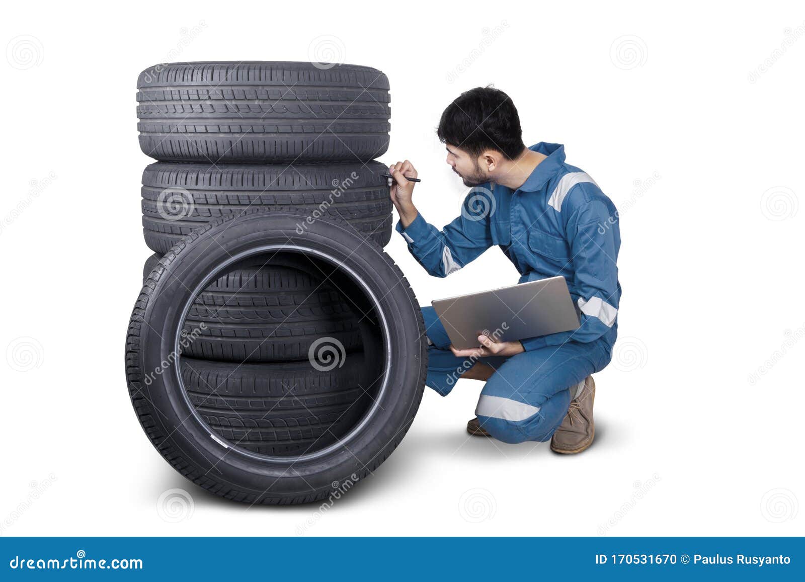 Mechanic Checking Tire Texture in Studio Stock Photo - Image of ...