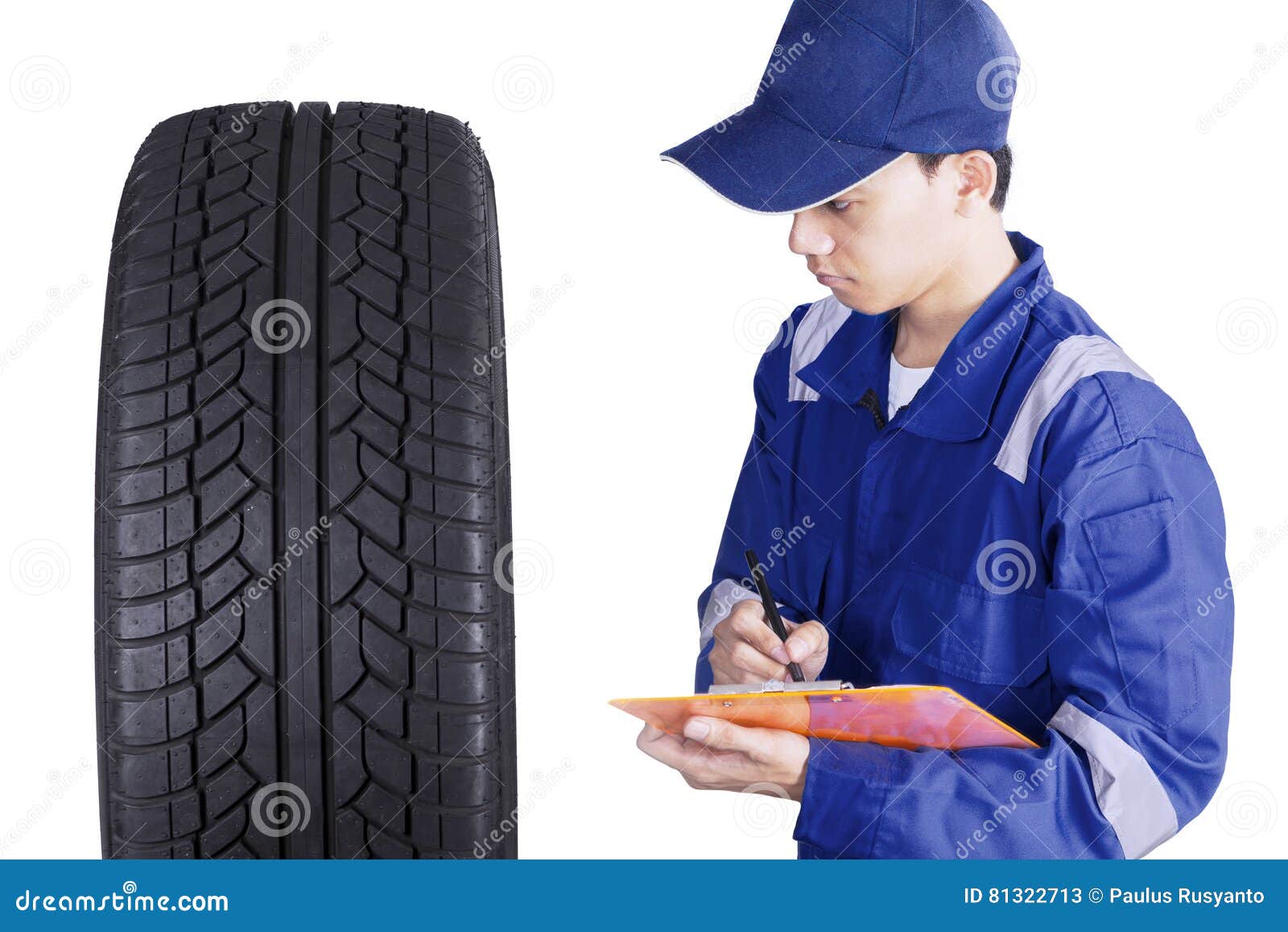Mechanic Checking a Tyres in the Studio Stock Image - Image of ...