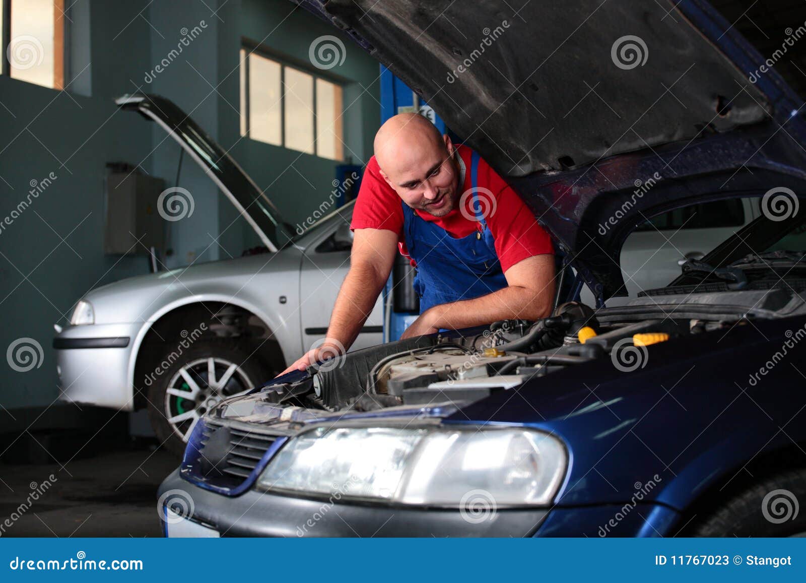 A Mechanic Checking a Vehicle Stock Image - Image of look, blue: 11767023