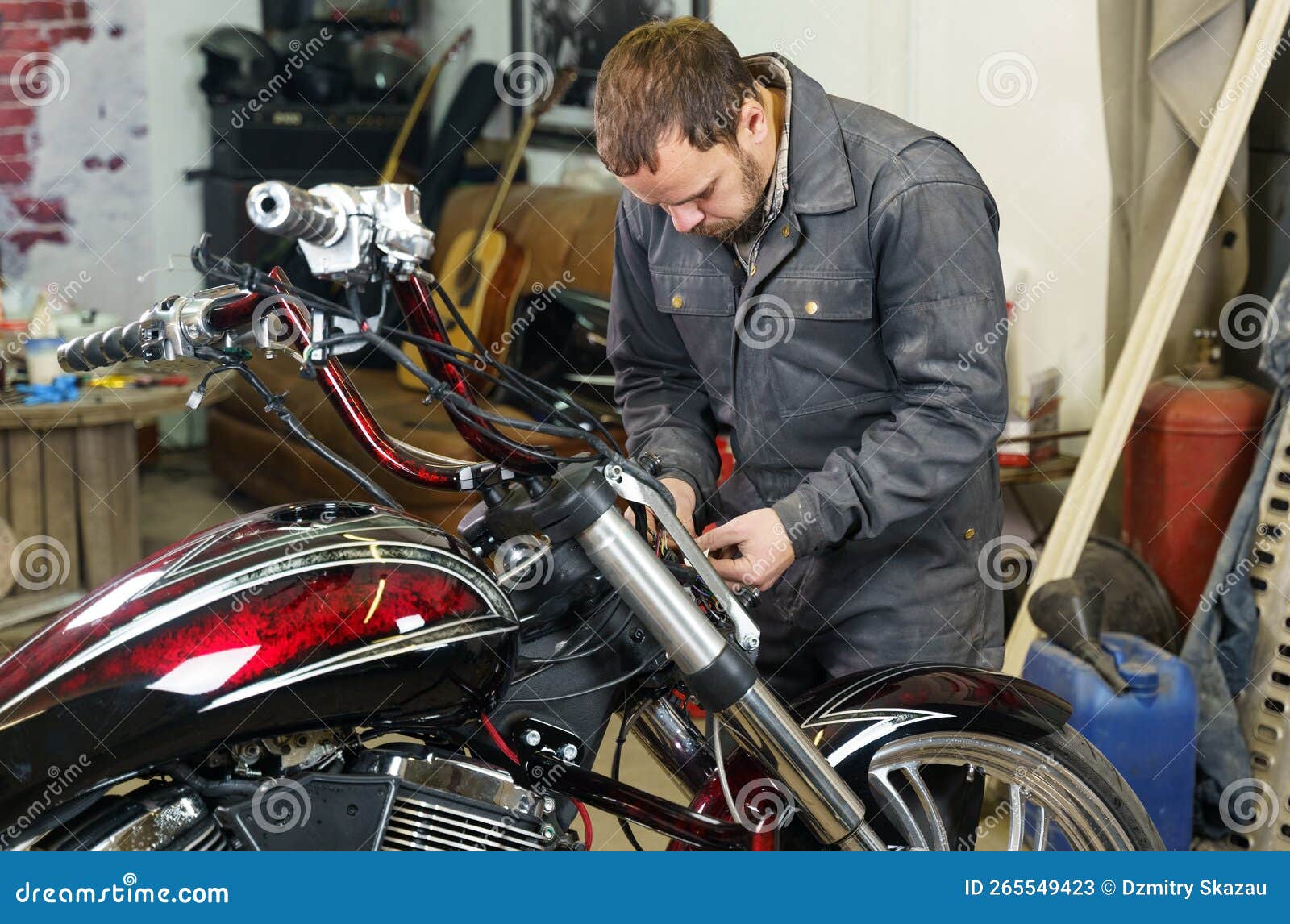 The Mechanic Connects the Electrical Cables of the Motorcycle. Stock ...