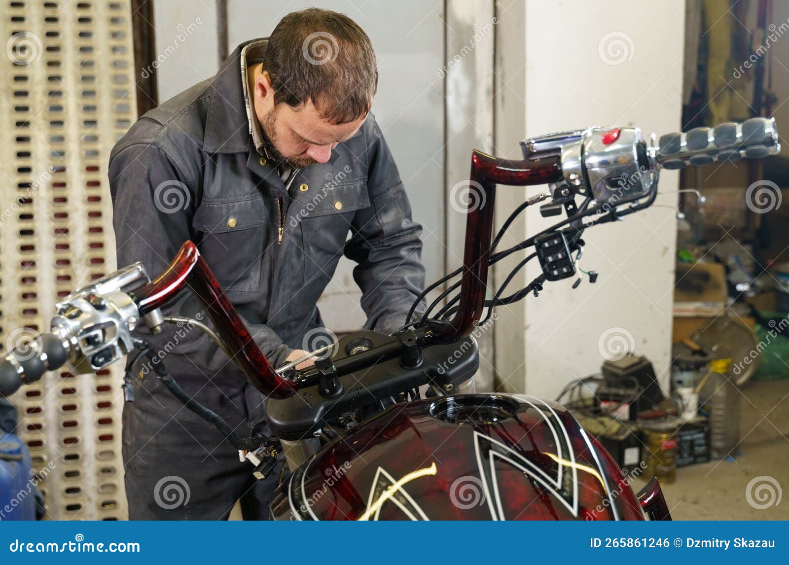 The Mechanic Connects the Electrical Cables of the Motorcycle. Stock ...