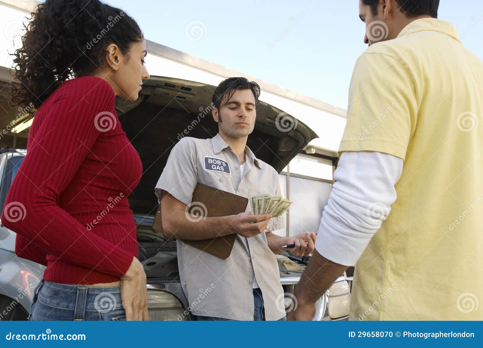 Mechanic Counting Money by Couple Stock Photo - Image of professional ...
