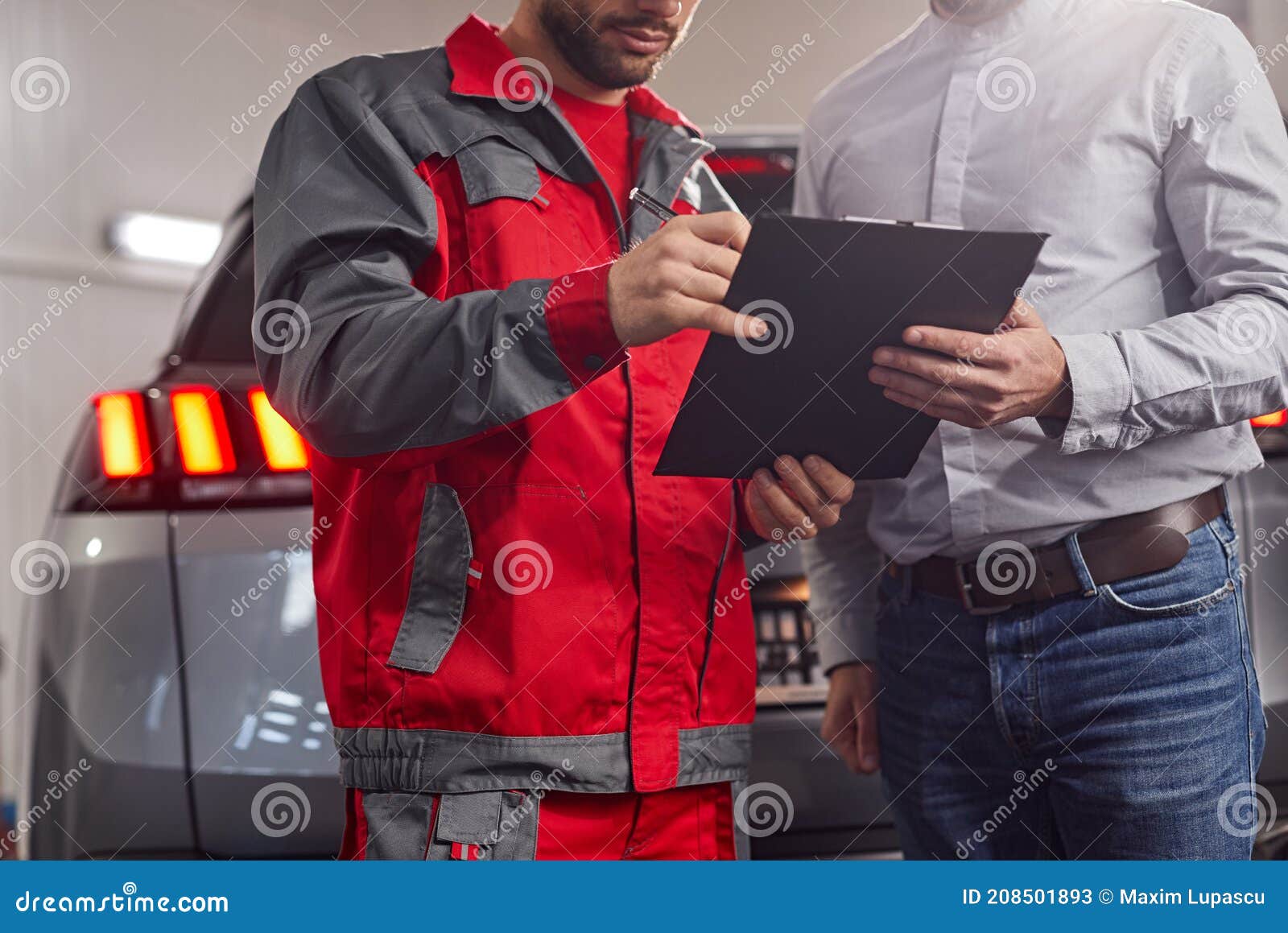 Mechanic and Customer Filling Documents in Car Service Workshop Stock ...