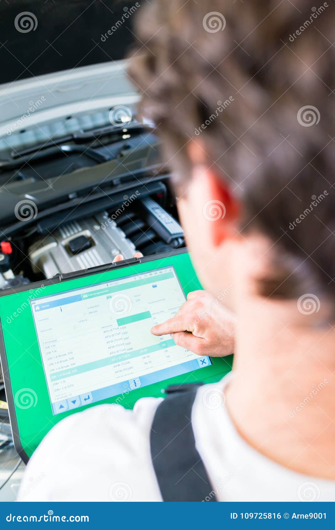 Mechanic with Diagnostic Tool in Car Workshop Stock Photo - Image of ...