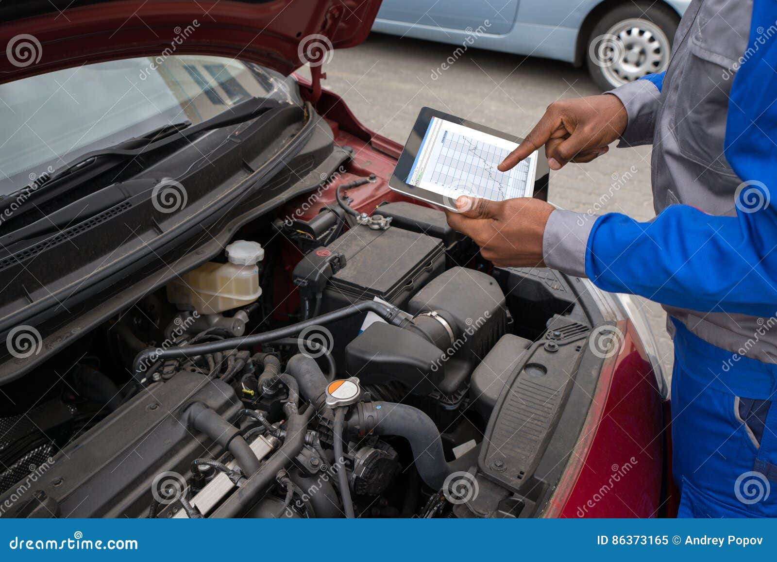 Mechanic with Digital Tablet while Examining Car Stock Image - Image of ...