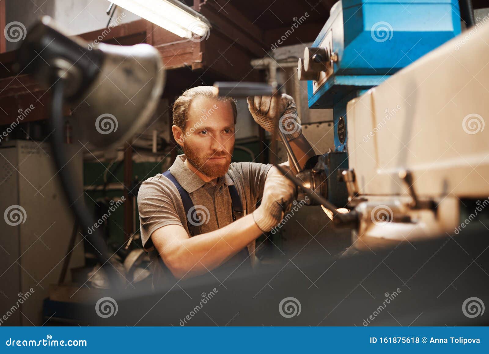 Mechanic doing his work stock photo. Image of industry - 161875618