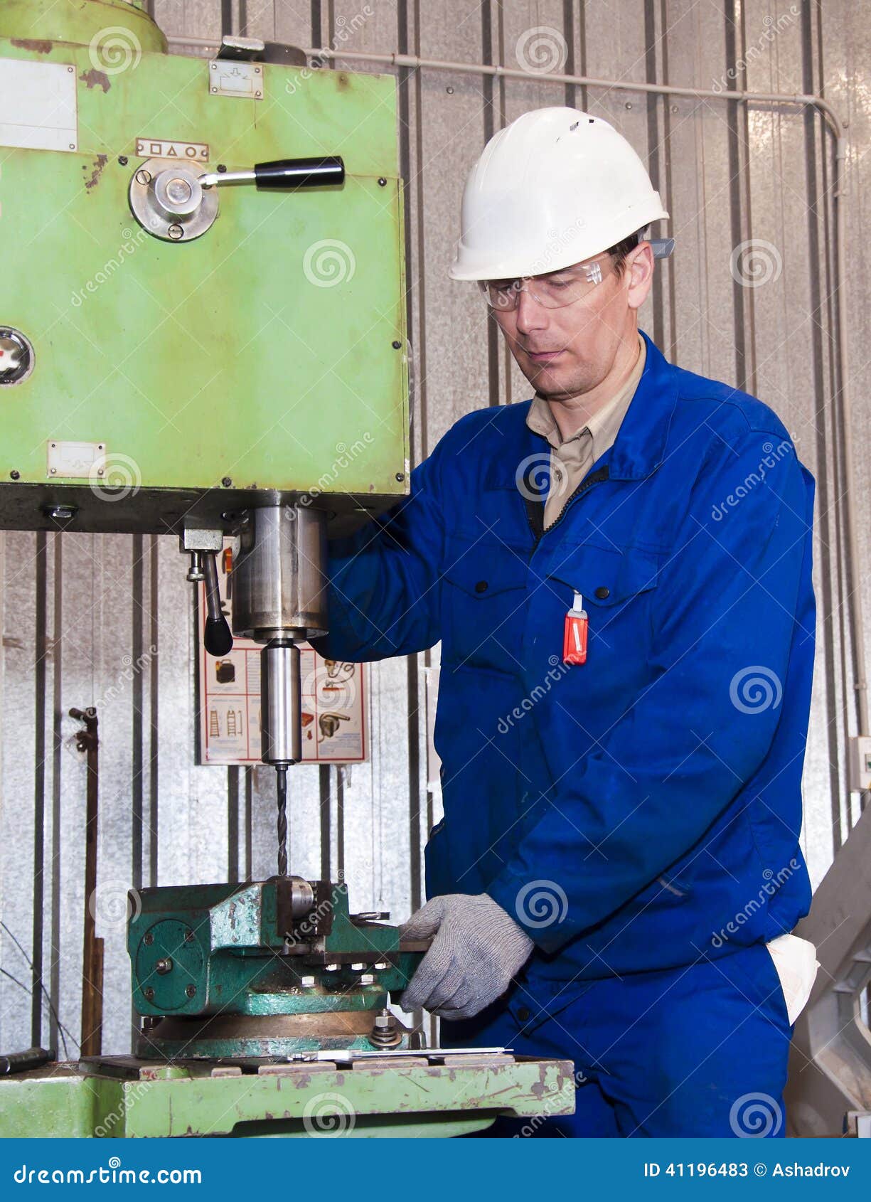 The Mechanic Dressed in Overalls, Works at the Boring Machine Stock ...