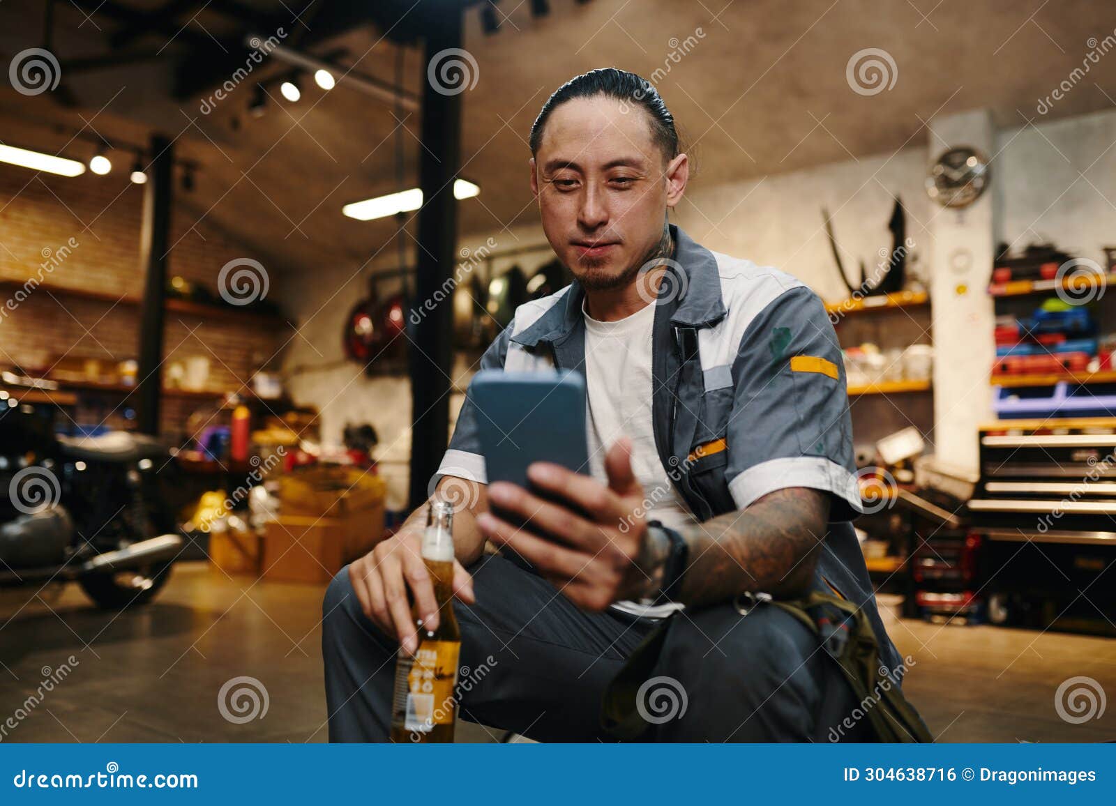 Mechanic Drinking Bottle of Beer Stock Photo - Image of smiling ...