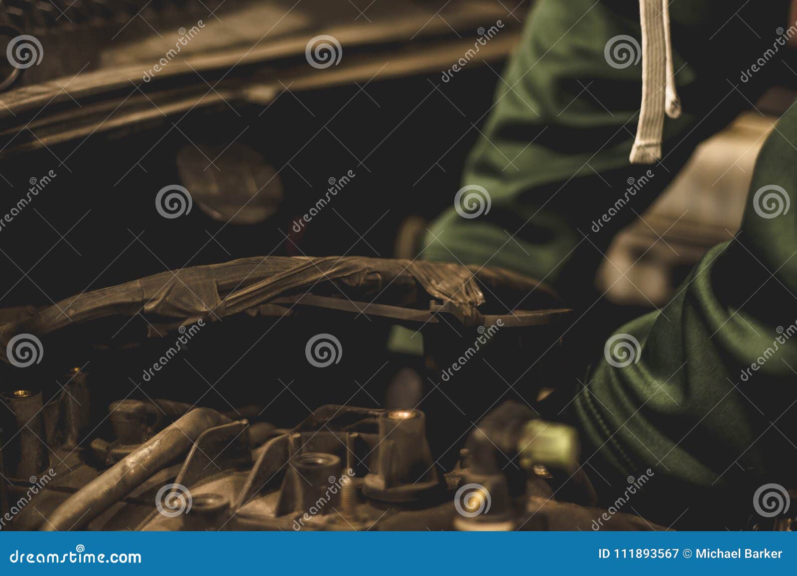 Mechanic in Engine Compartment of an SUV. Stock Image - Image of ...