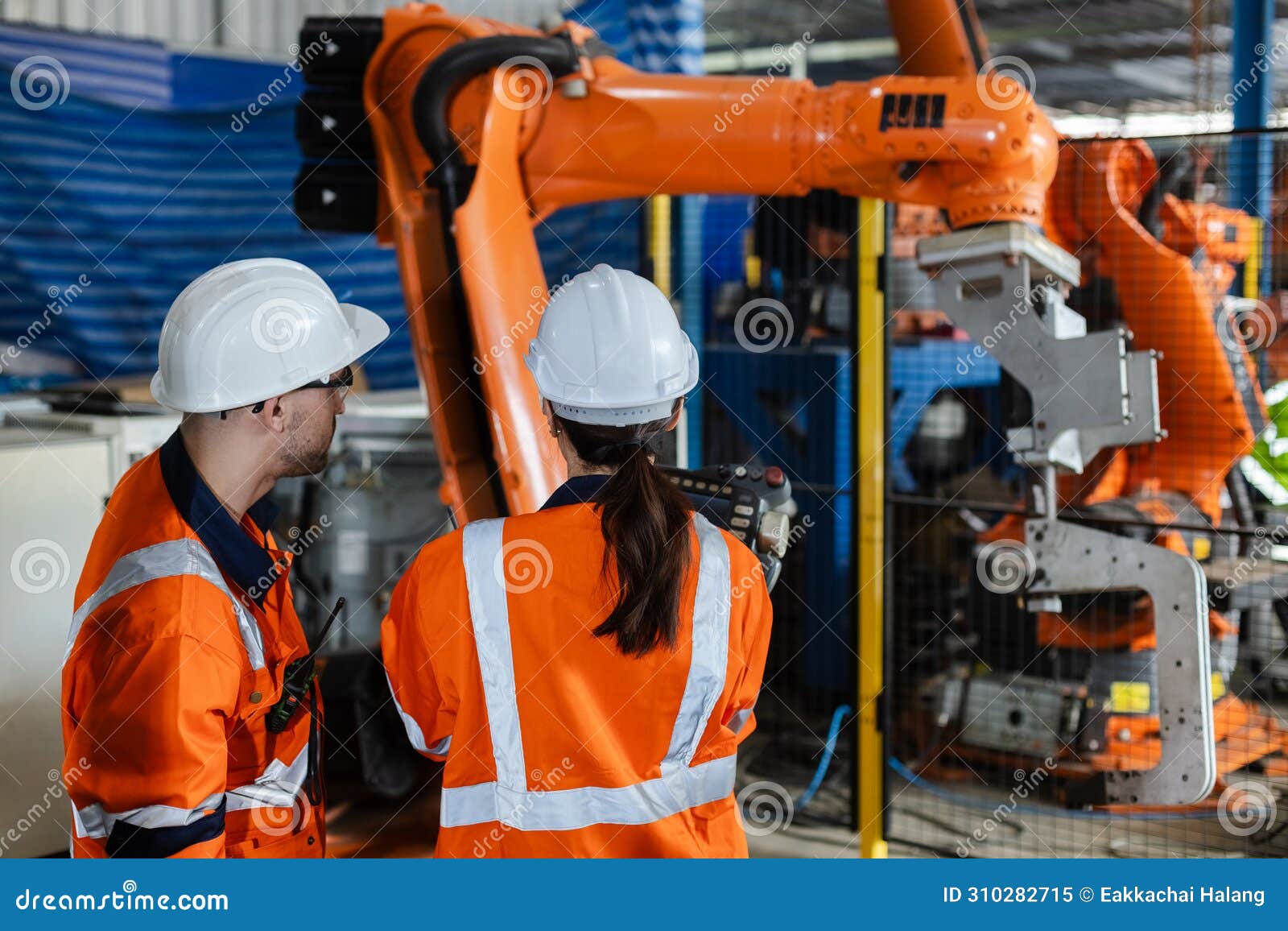 Mechanic Engineer Man and Woman Using Talkie Walkie are Checking ...