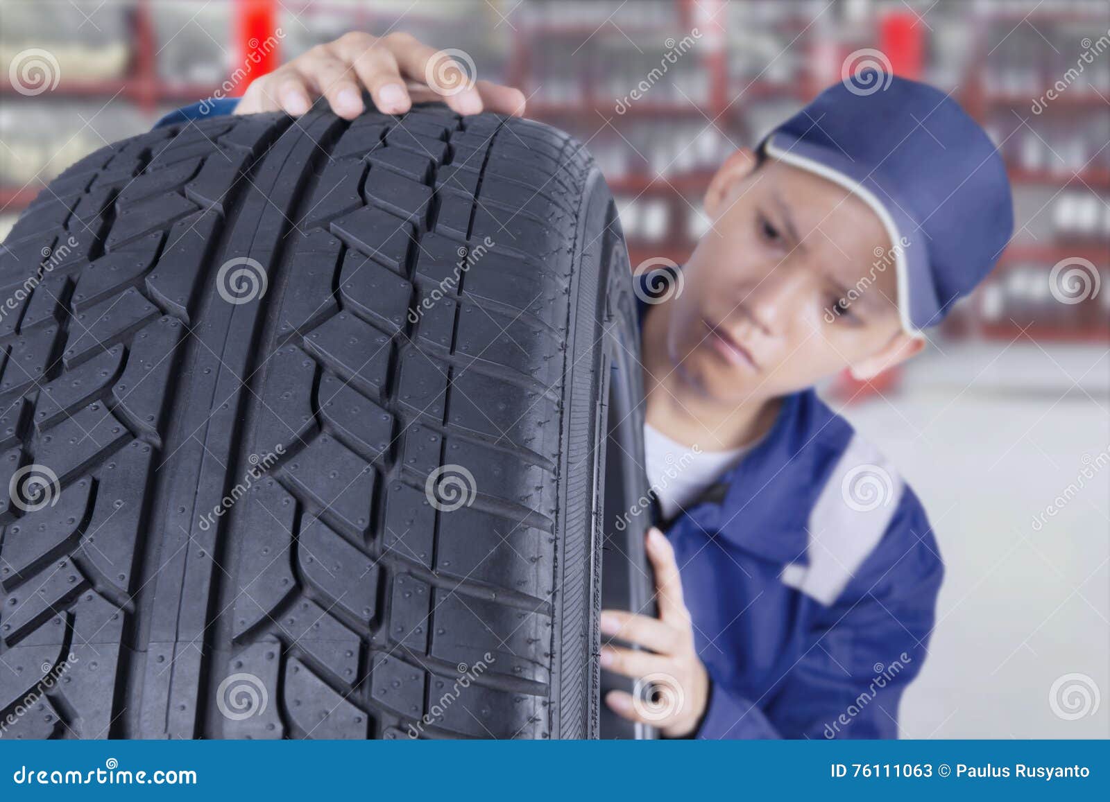 Mechanic Examining Tyre in the Workshop Stock Image - Image of repair ...