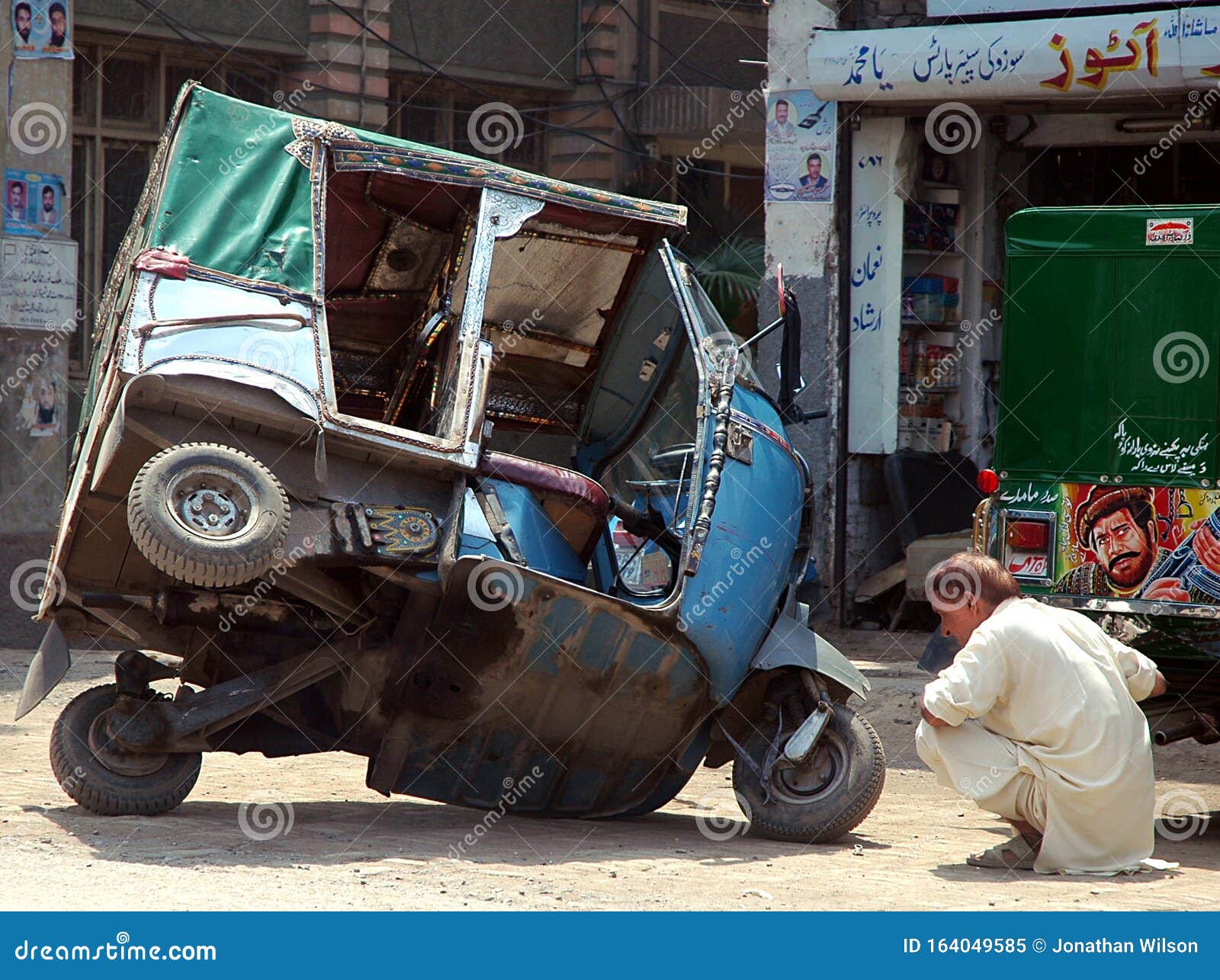 A Mechanic Fixes a Problem with His Rickshaw in Peshawar, Pakistan ...