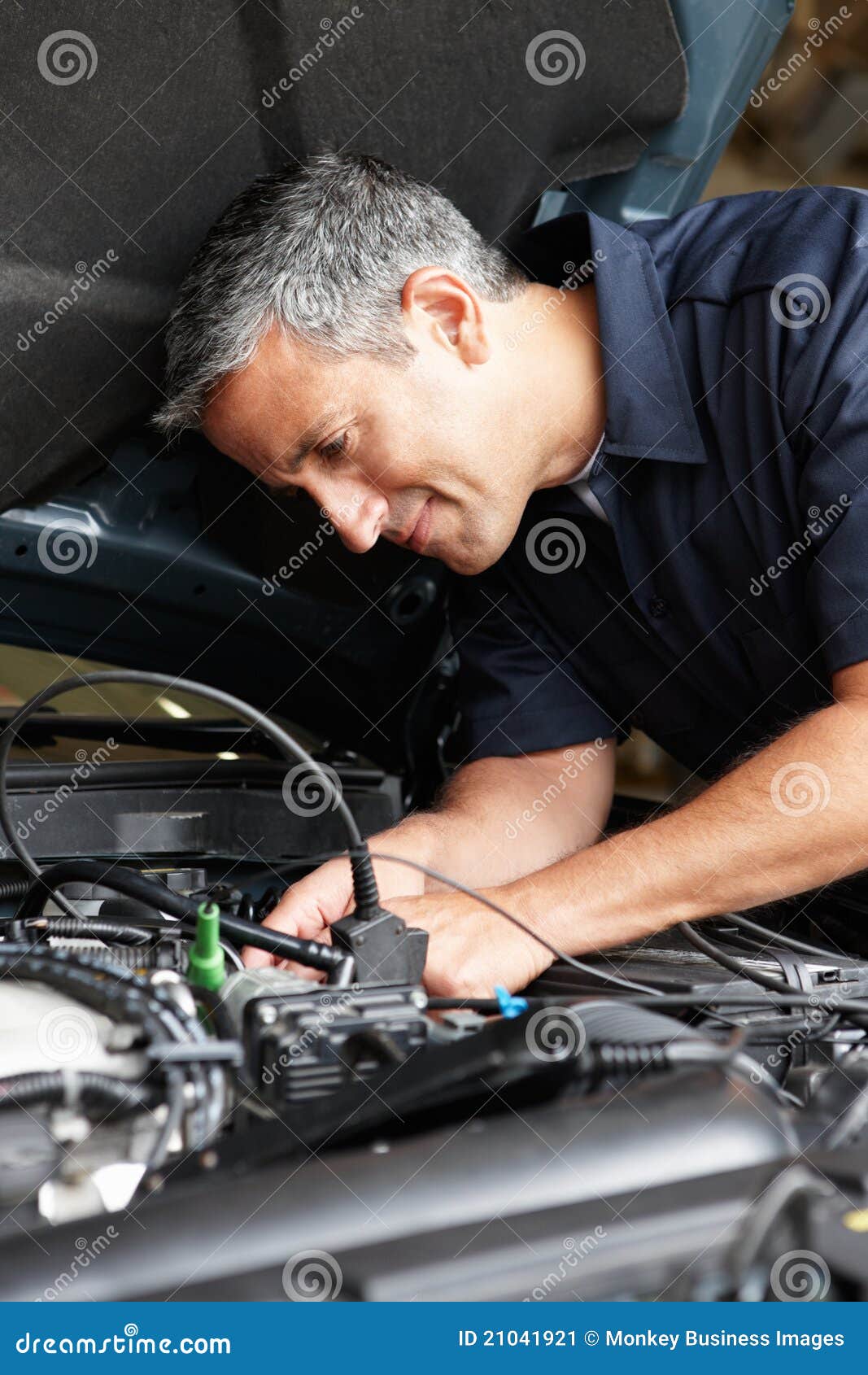 Mechanic fixing car stock image. Image of automobile - 21041921