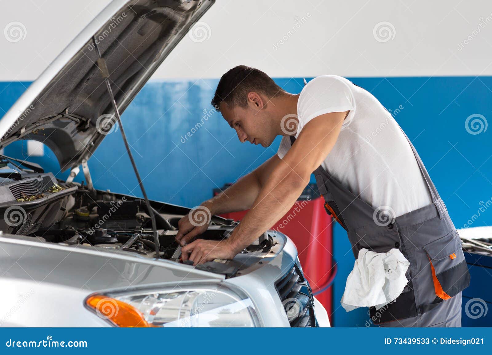 Mechanic fixing car engine stock image. Image of engine - 73439533