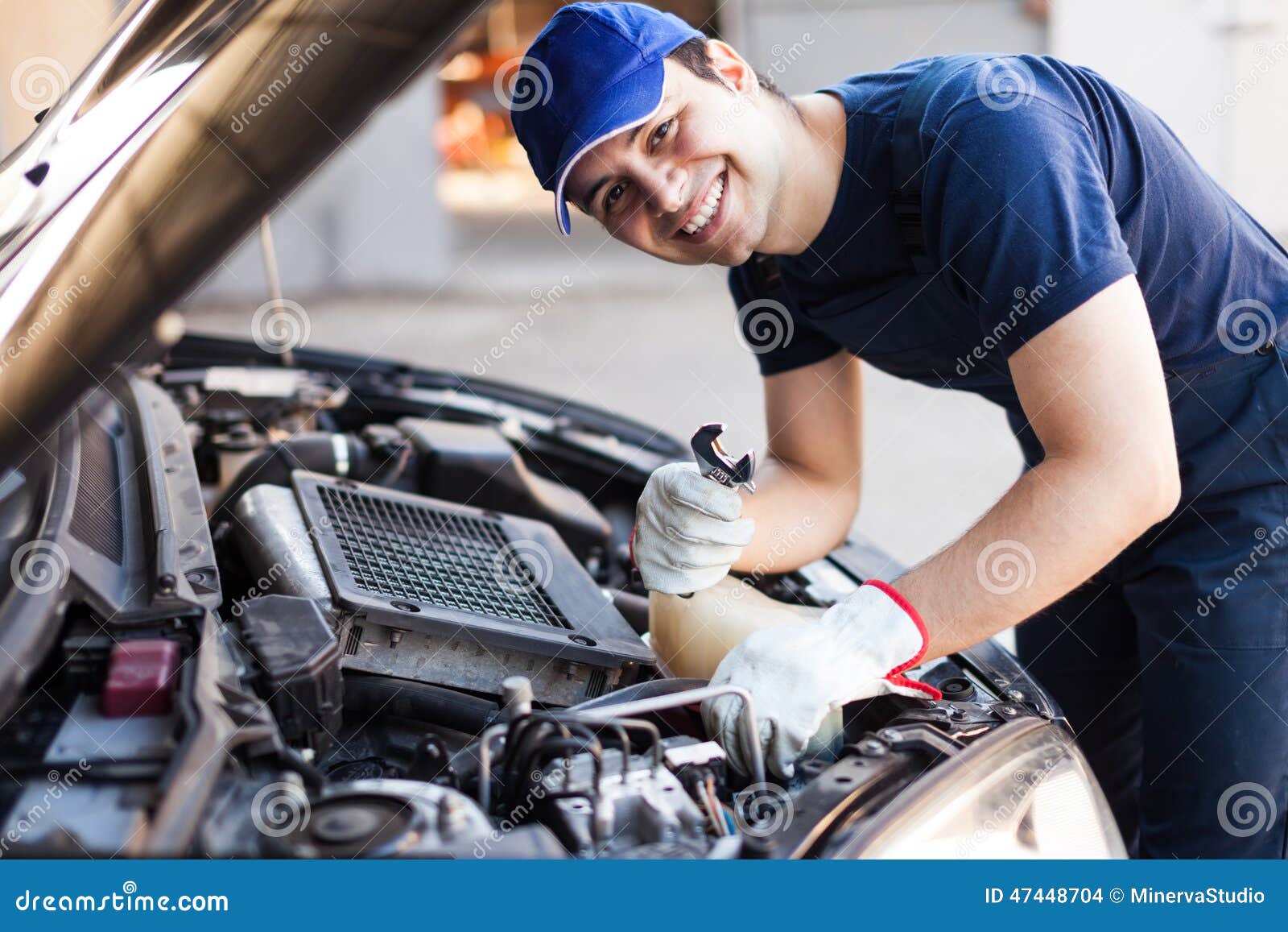 Mechanic Fixing a Car Engine Stock Photo - Image of tool, person: 47448704