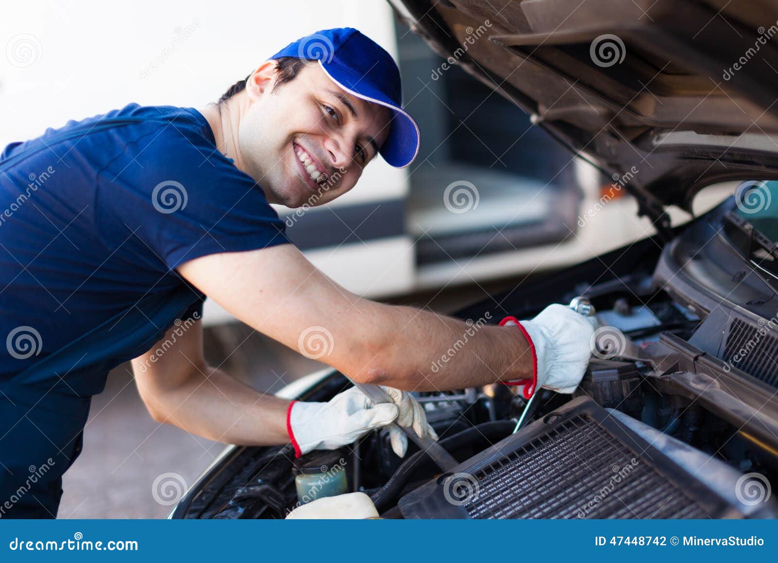 Mechanic Fixing a Car Engine Stock Photo - Image of check, friendly ...