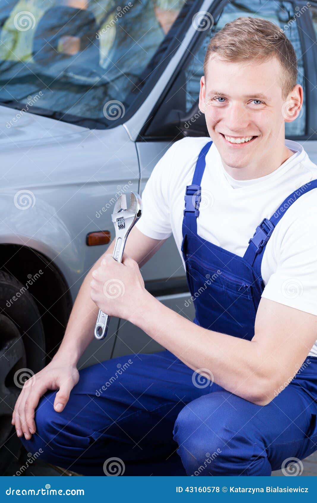 Mechanic Fixing Car and Smiling Stock Photo - Image of machinist ...