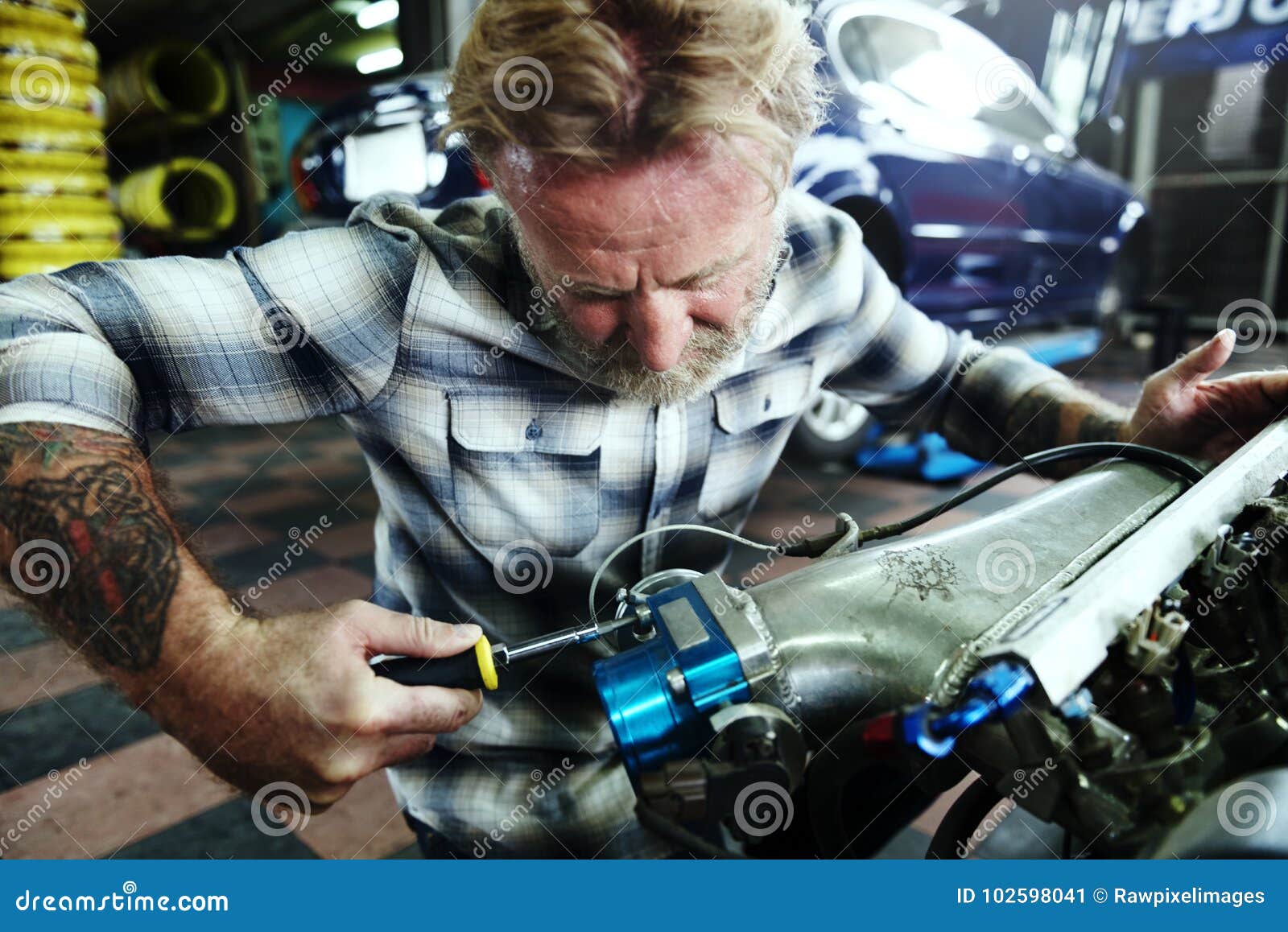 A Mechanic Fixing an Engine Stock Image - Image of profession, shop ...