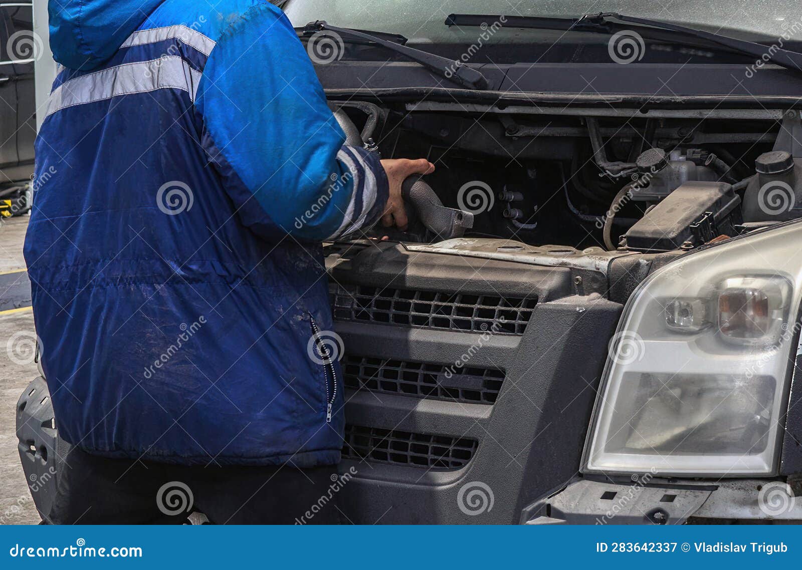 Mechanic Fixing the Engine of a Van Stock Image - Image of engineer ...