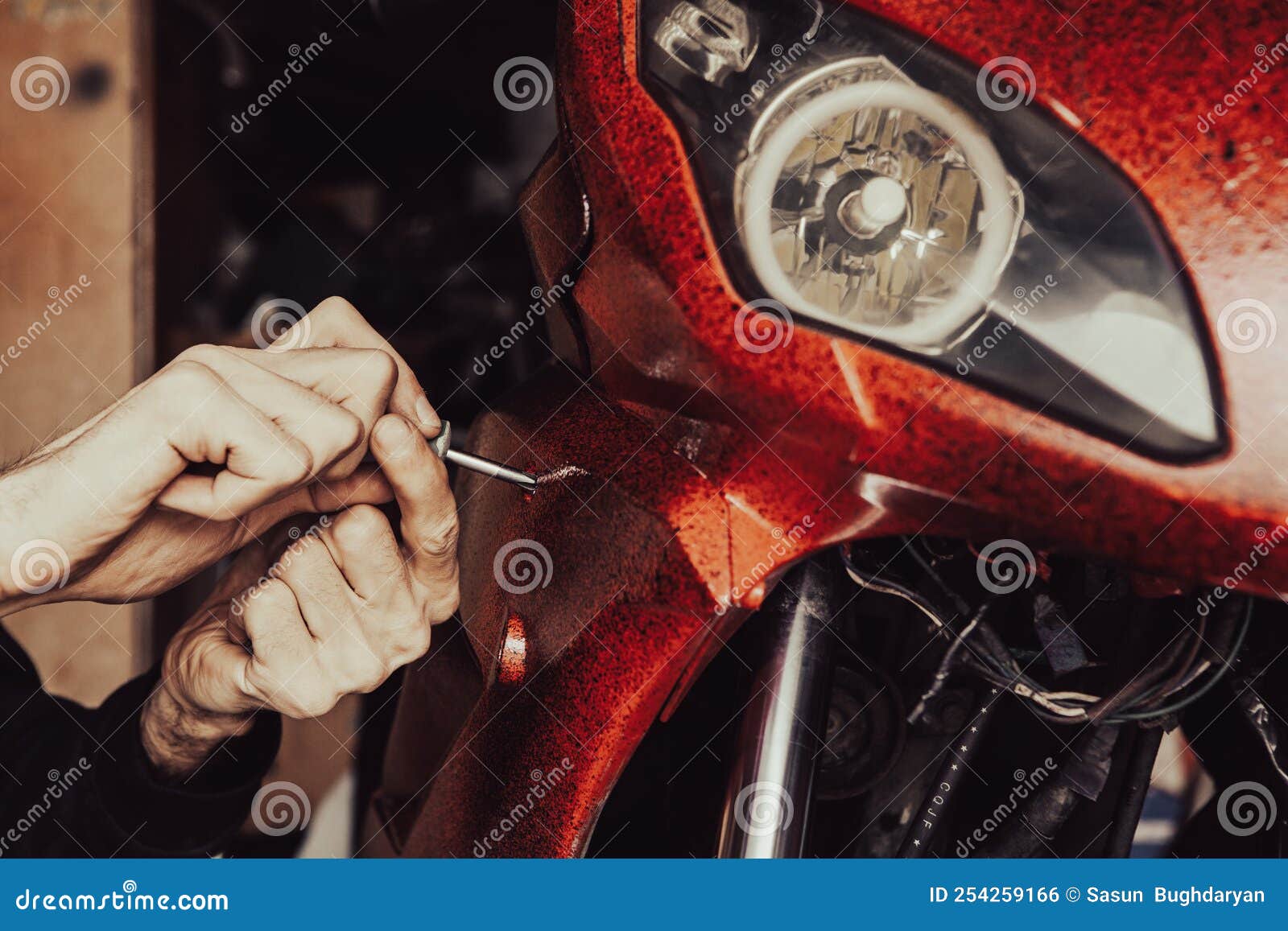 Mechanic Fixing a Motorcycle in the Garage Stock Photo - Image of ...