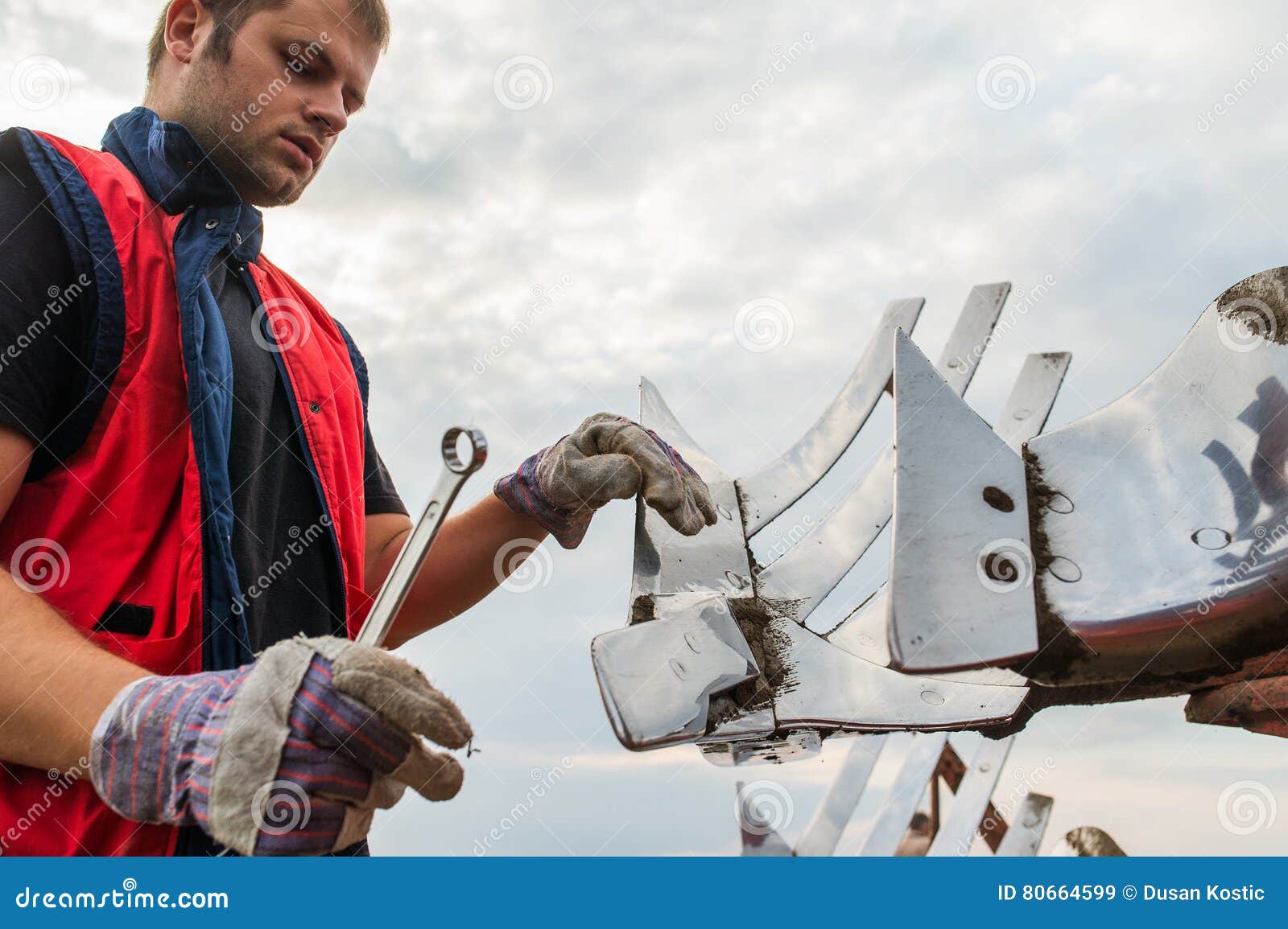 Mechanic Fixing Plow on the Tractor Stock Image - Image of agriculture ...