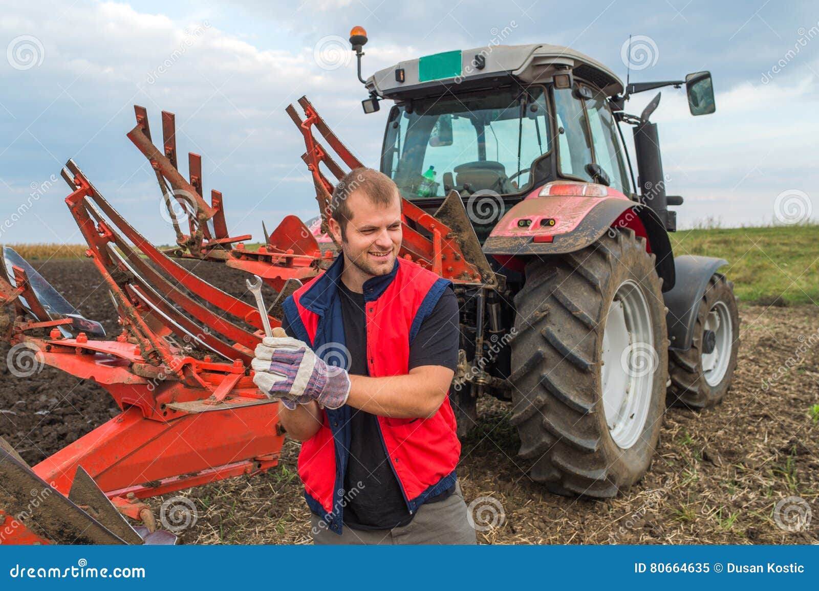 Mechanic Fixing Plow on the Tractor Stock Image - Image of mechanic ...