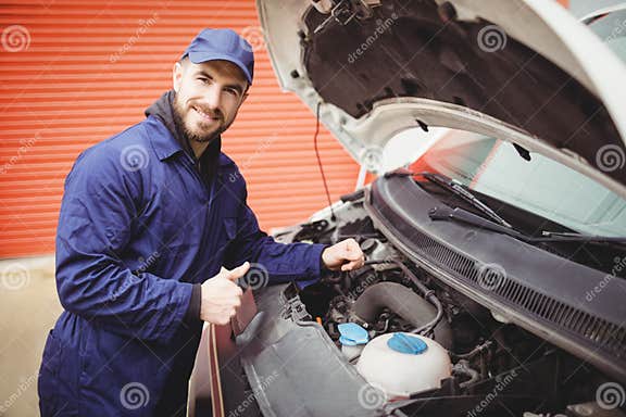Mechanic fixing a van stock image. Image of person, happy - 67726667