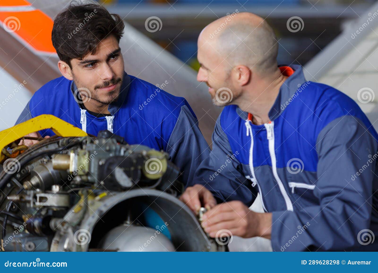 Mechanic and Flight Engineer Having Discussion Stock Photo - Image of ...