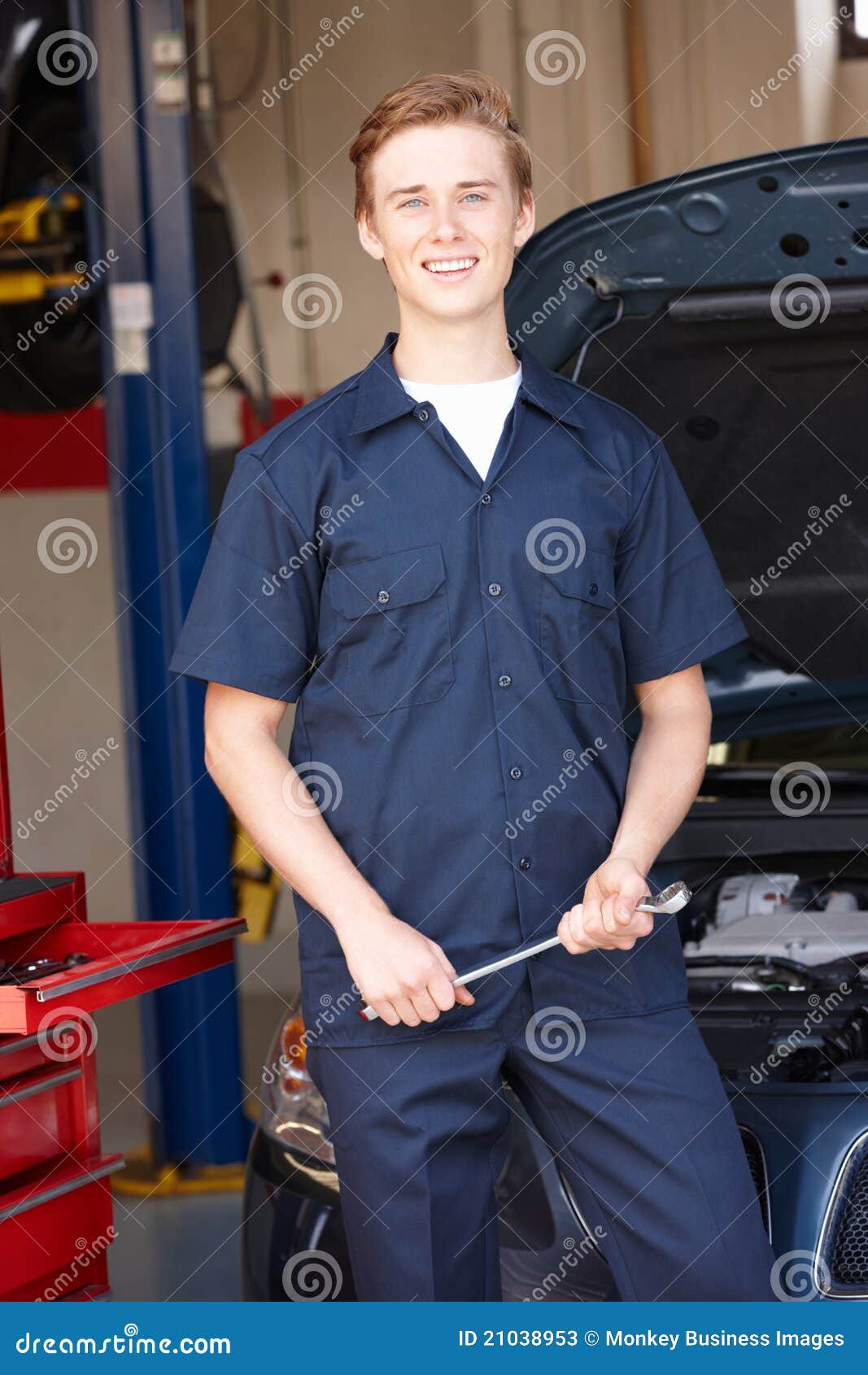 Mechanic in Front of Car at Work Stock Image - Image of smiling ...