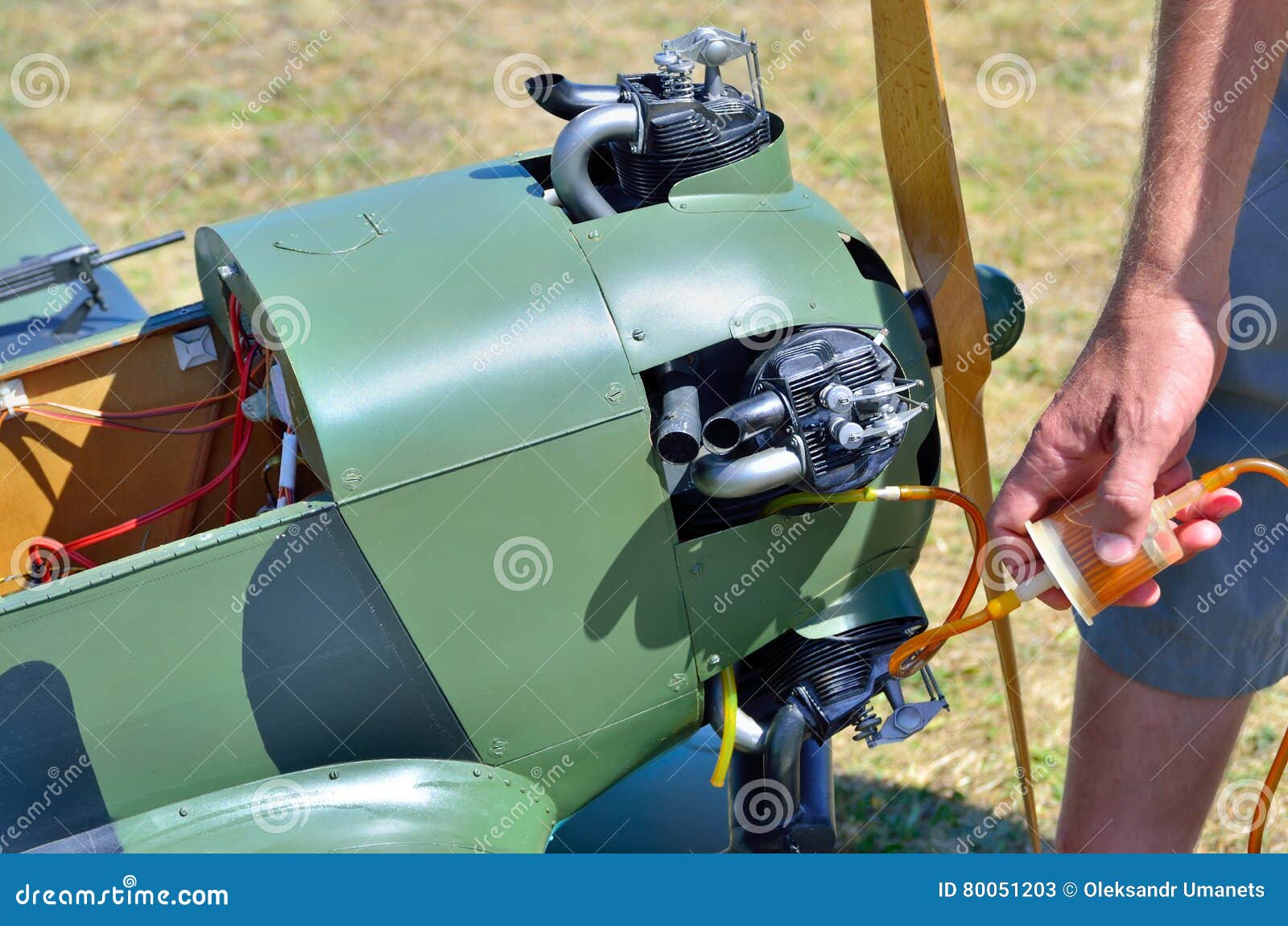 Military Mechanic In Camouflage Working Underneath An Old Vehicle. The ...