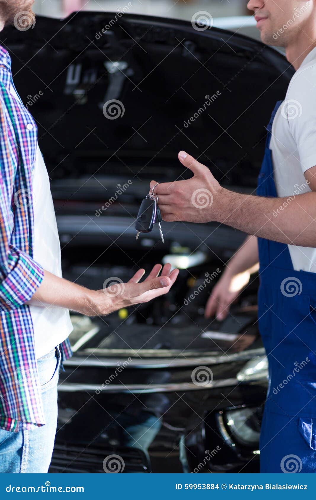 Mechanic giving car keys stock photo. Image of engineer - 59953884