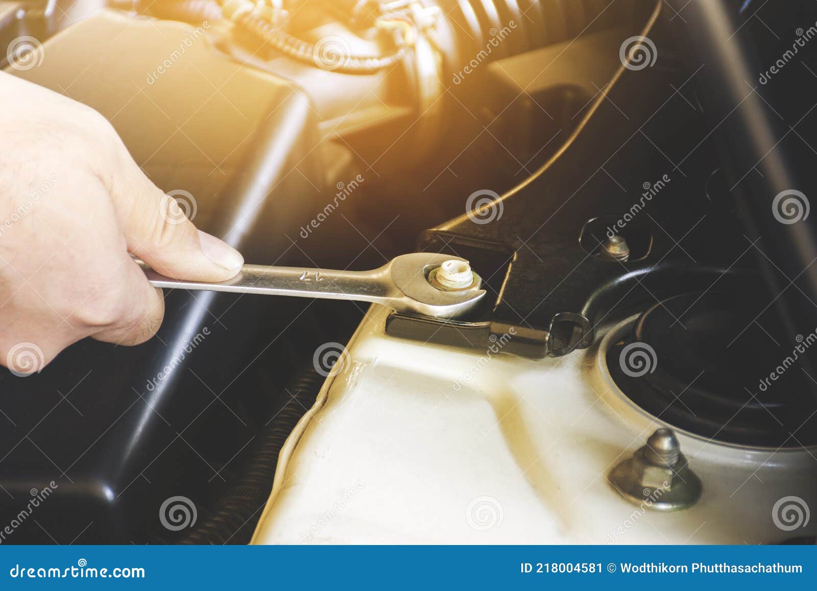Hand is Unscrewing the Metal Nut with a Combination Wrench Spanner ...