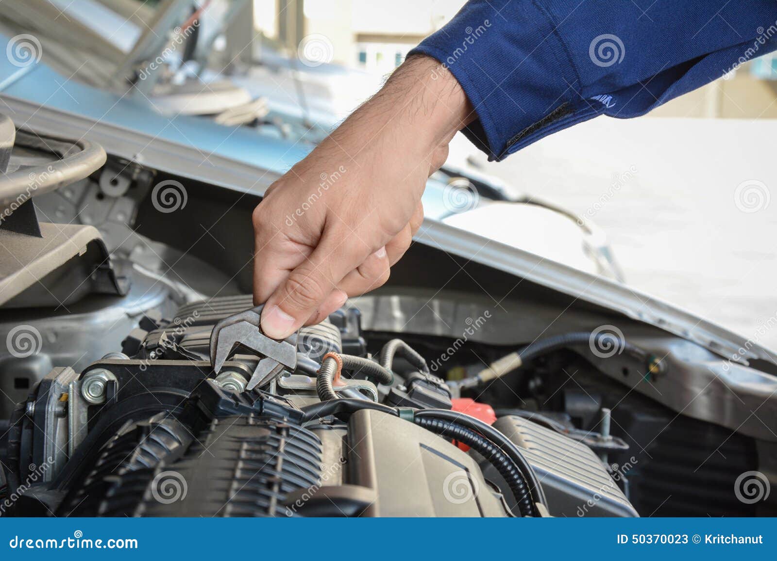 Mechanic Hand Checking And Fixing A Broken Car In Garage.Inspec Royalty ...
