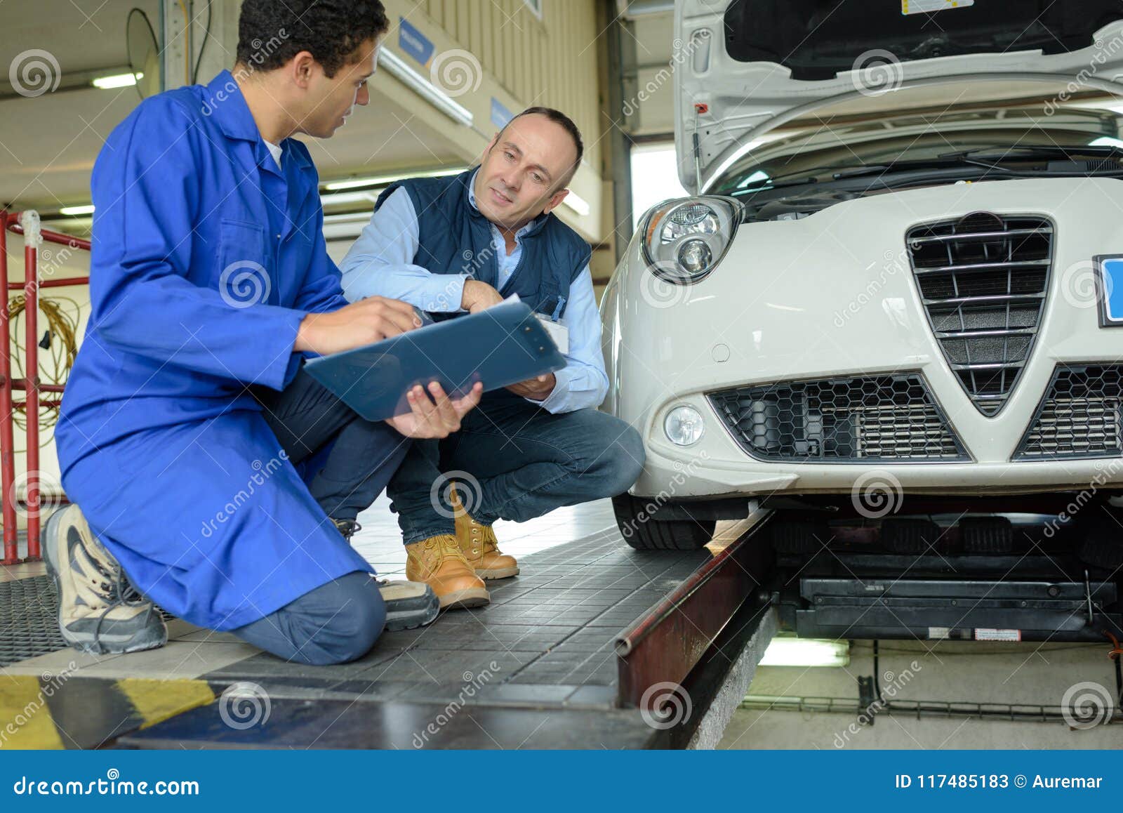 Mechanic Helping Apprentice To Fix Engine Stock Image - Image of ...