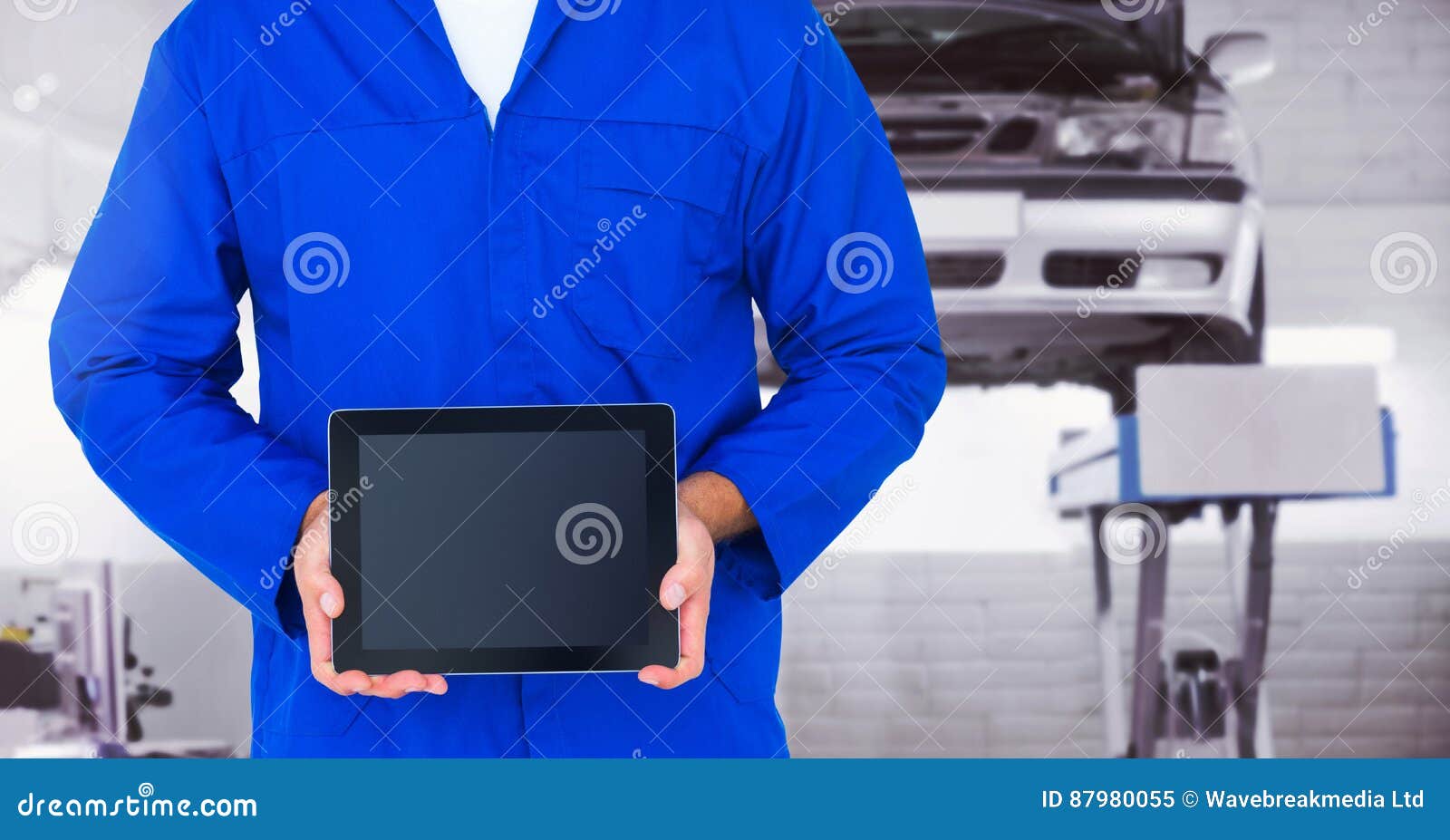 Mechanic Holding a Digital Tablet at Workshop Stock Image - Image of ...