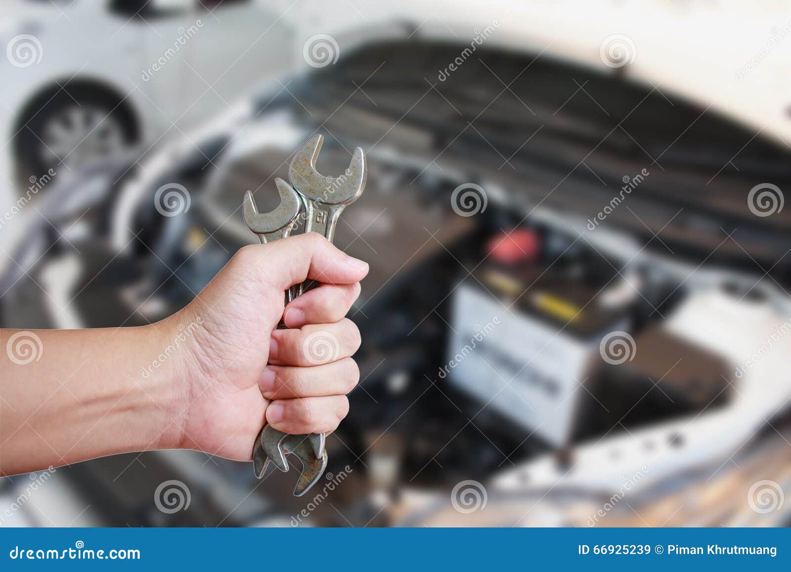 Mechanic Holding Spanner stock image. Image of repair - 66925239