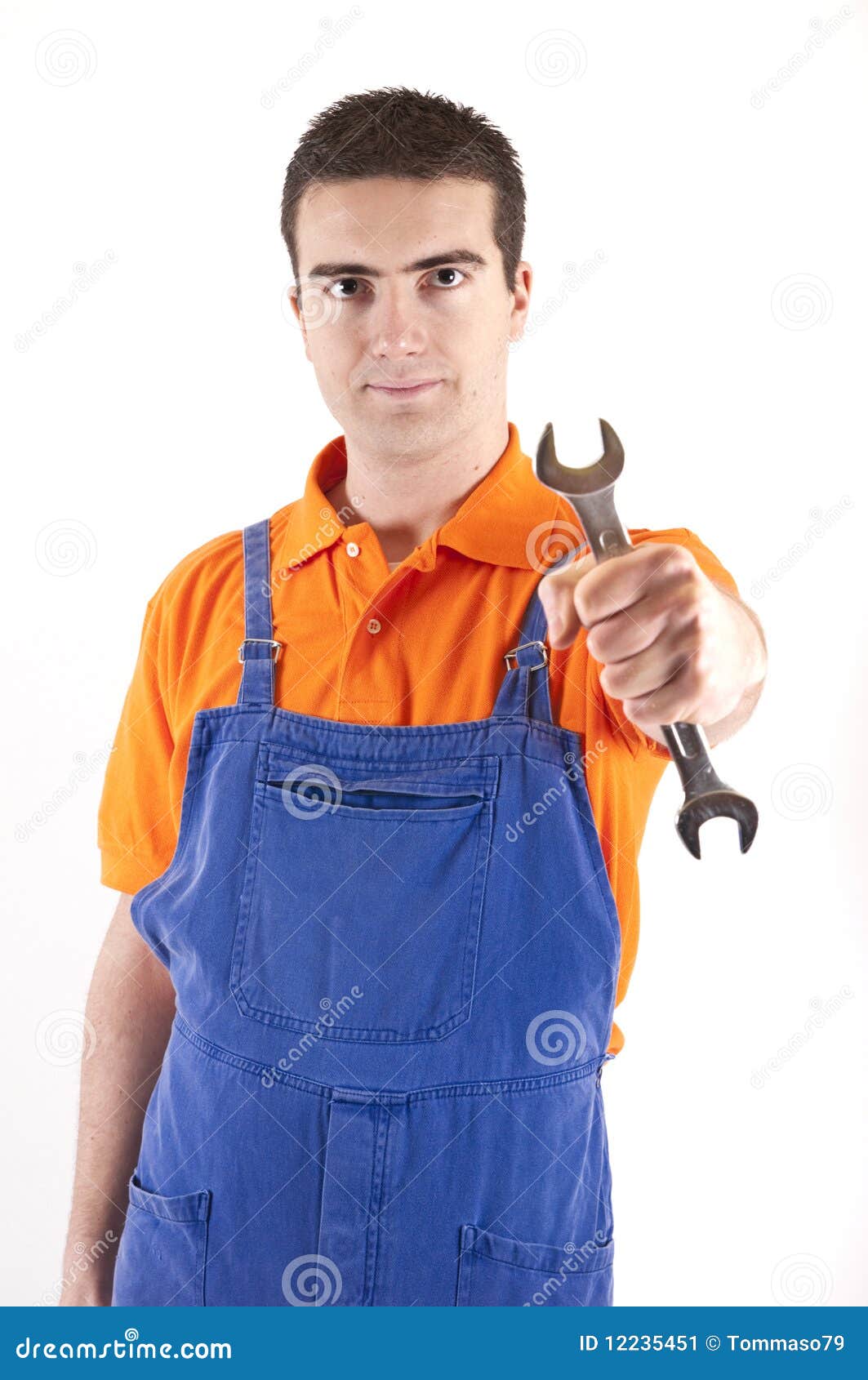 Mechanic holding a wrench stock image. Image of equipment - 12235451