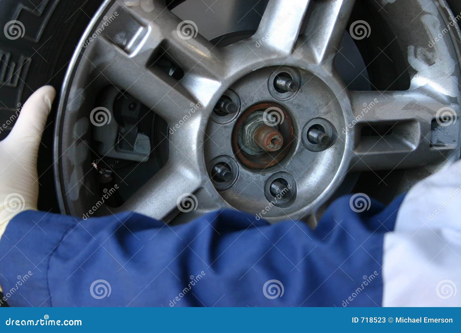 Mechanic installing wheel stock image. Image of brake, mechanic - 718523