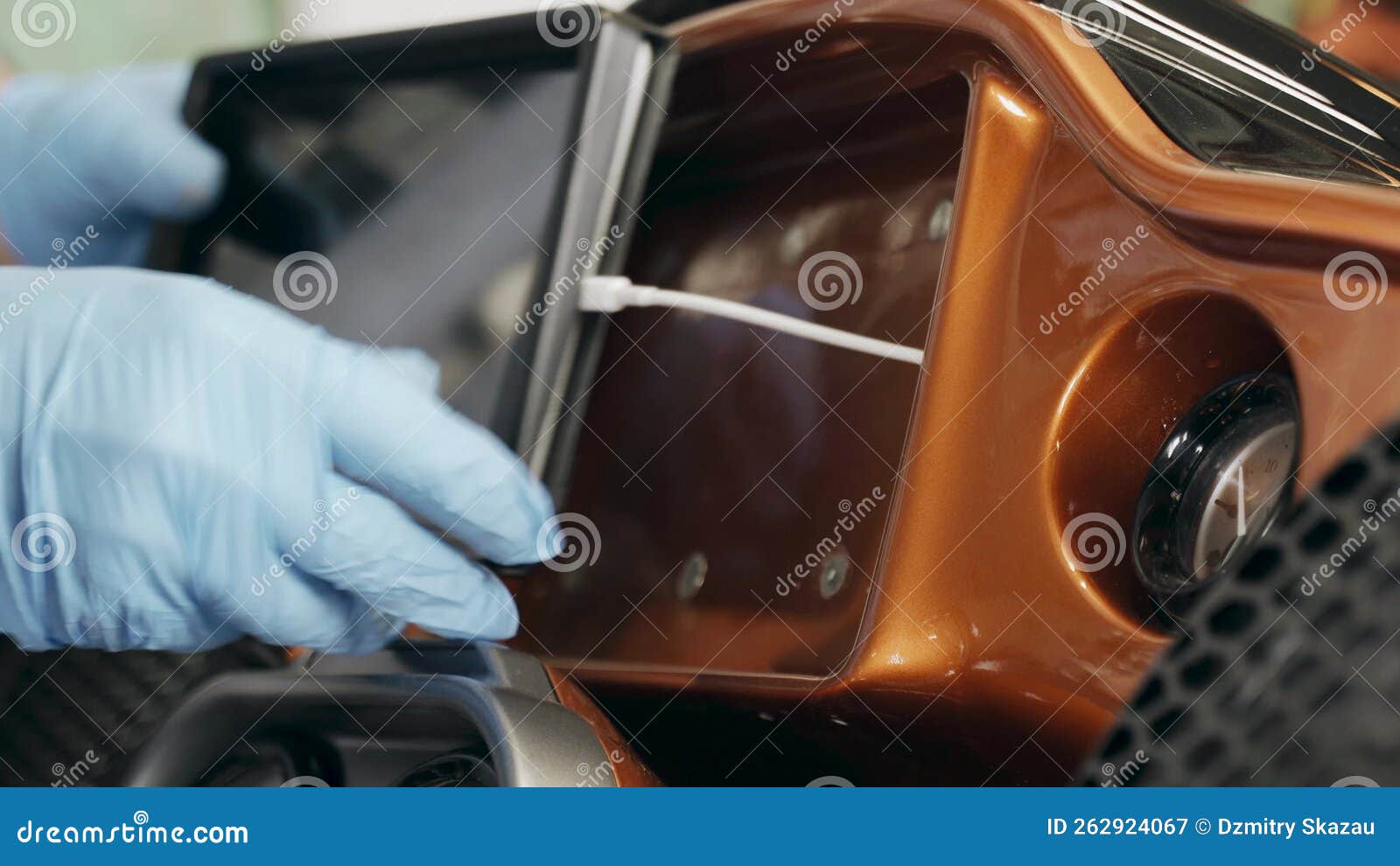 A Mechanic Installs a Tablet on a Motorcycle. Motorcycle Tuning Stock ...