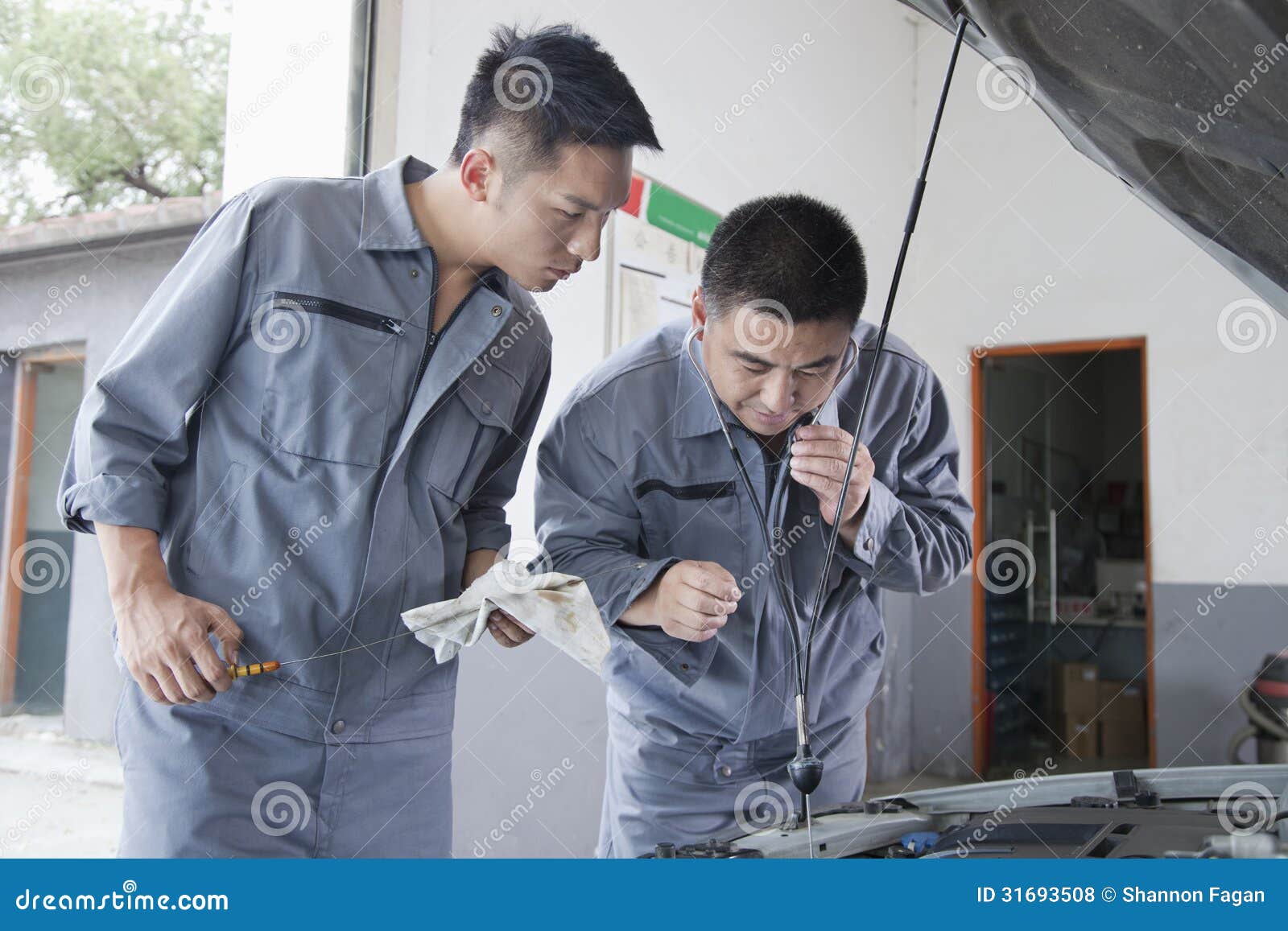 Mechanic Listening To Engine Stock Photo - Image of expertise, dipstick ...