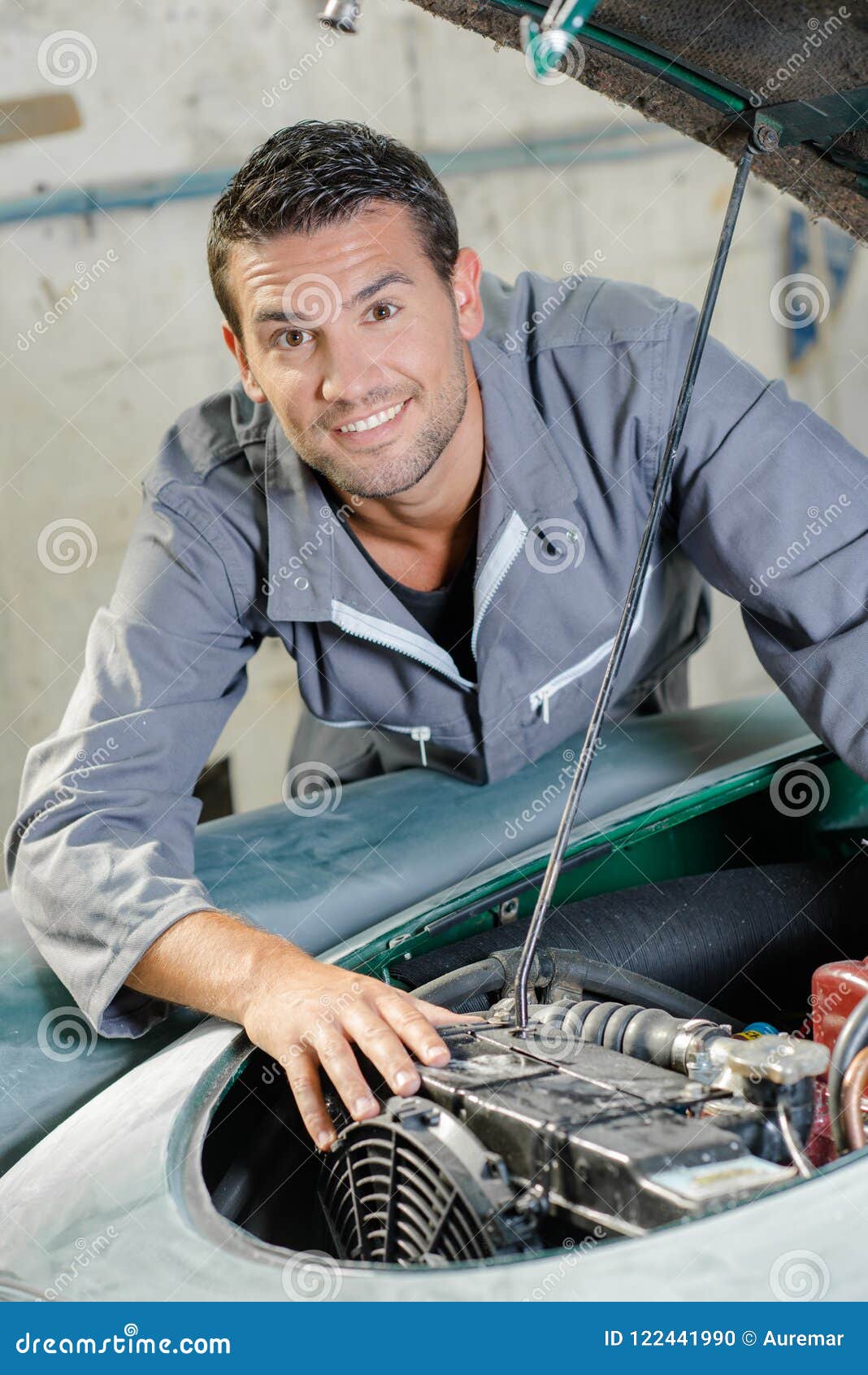 Mechanic Looking in Engine Bay Stock Photo - Image of motor, garage ...