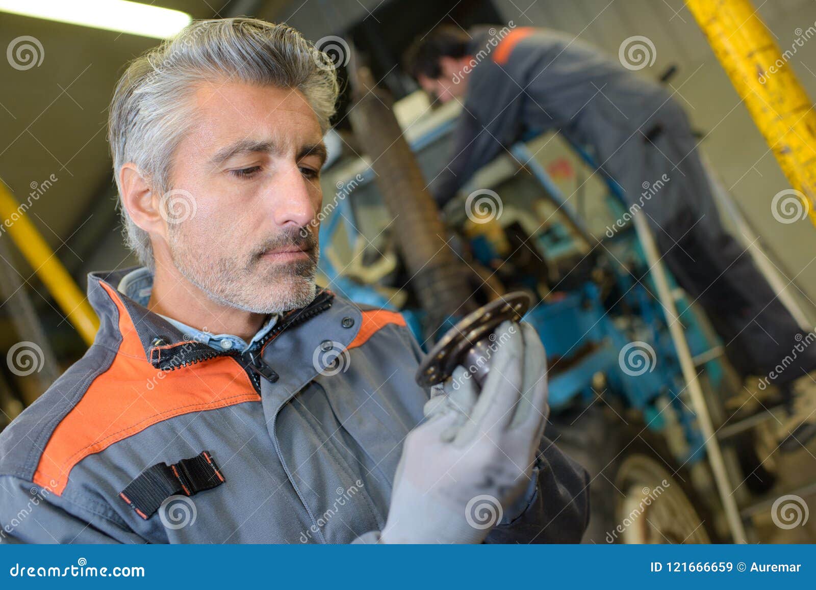Mechanic looking at part stock image. Image of worker - 121666659