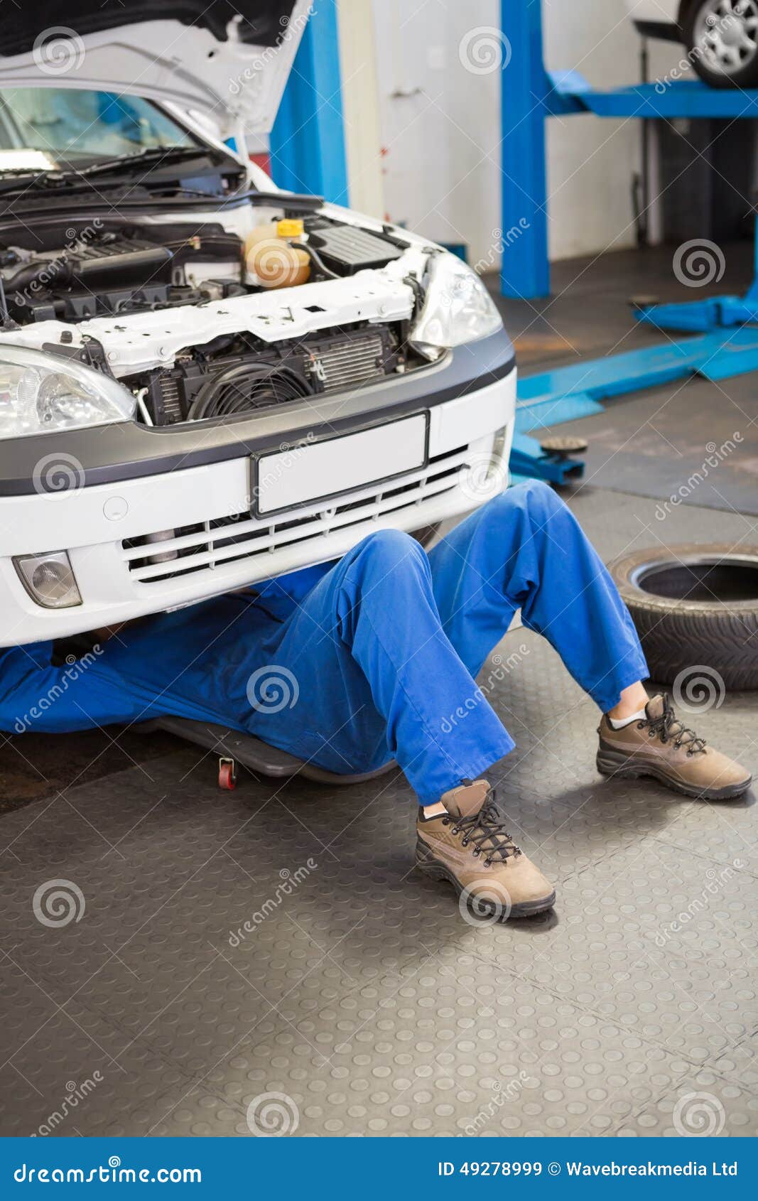 Mechanic Lying and Working Under Car Stock Image - Image of work ...