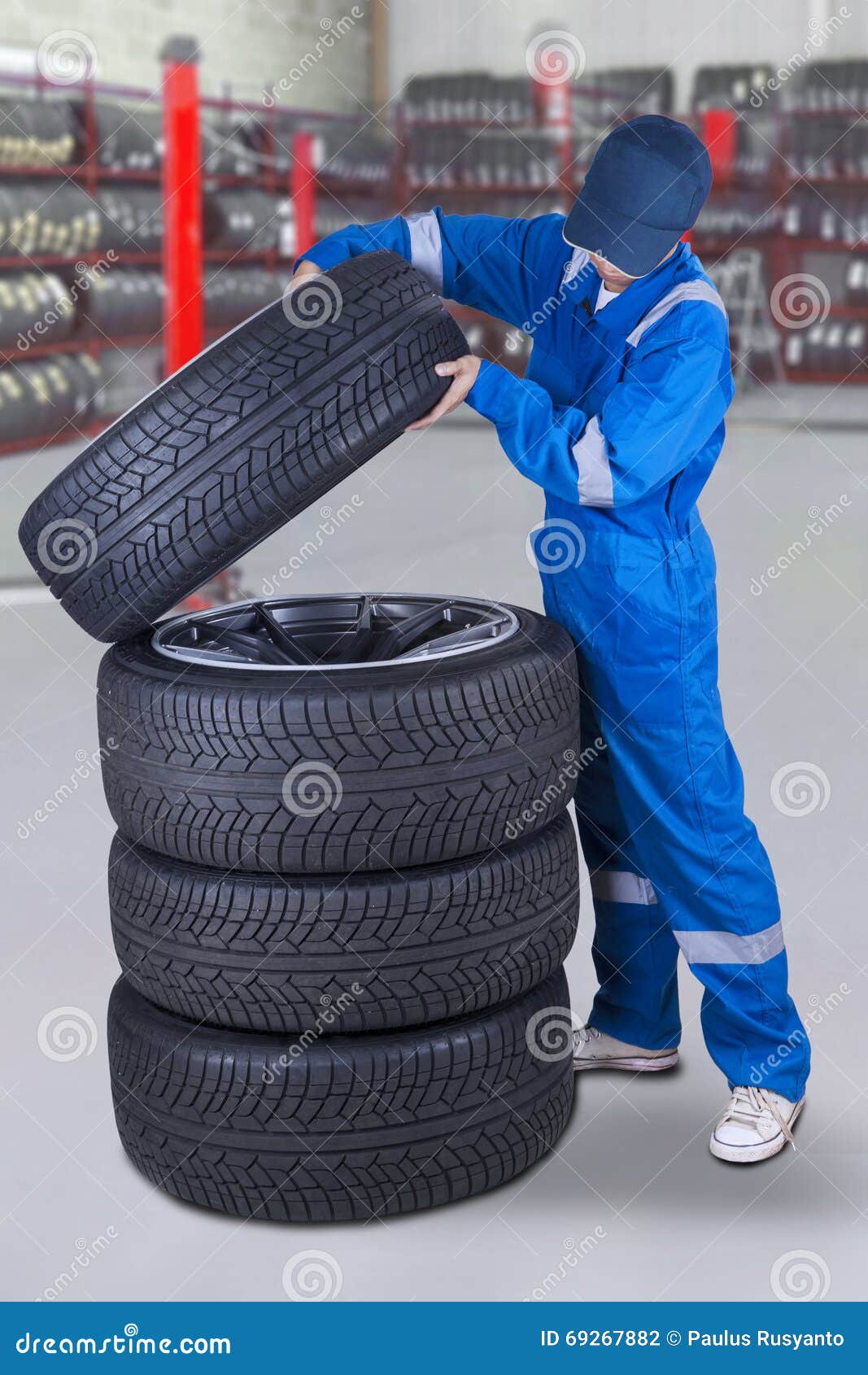 Mechanic Makes Stack Tires Stock Photos - Free & Royalty-Free Stock ...