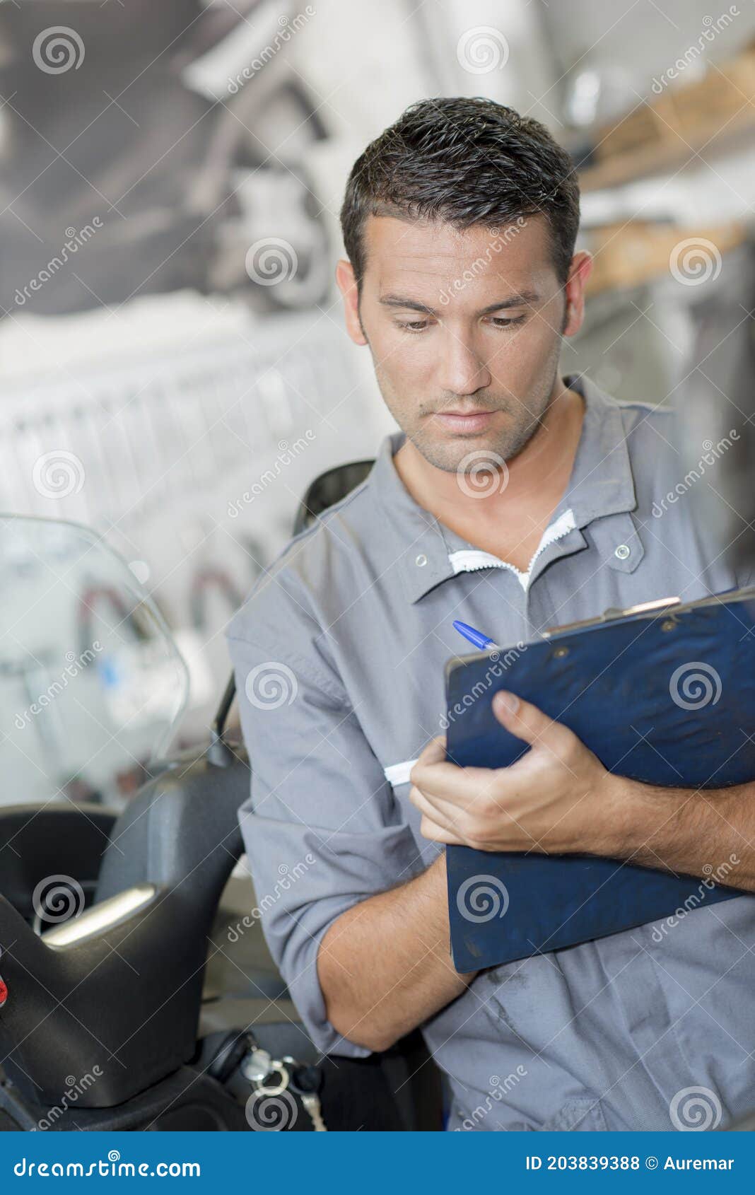 Mechanic Making Notes on Clipboard Stock Photo - Image of technician ...