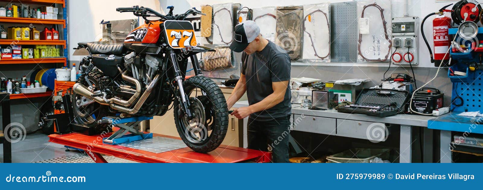Mechanic Man Checking Custom Motorcycle Over Platform Stock Image ...