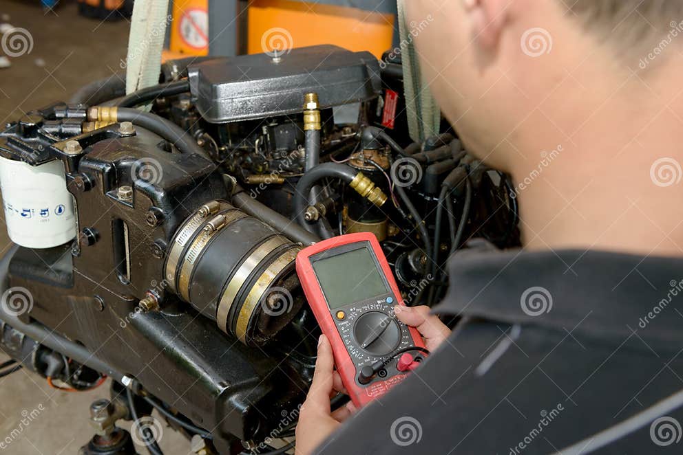 Mechanic Man with Digital Multimeter Testing Ignition Coil Stock Image ...
