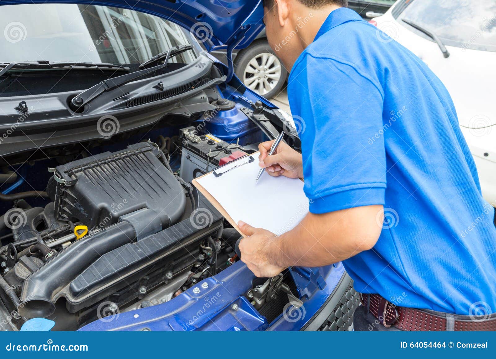 Mechanic Man Holding Clipboard and Check the Car Stock Photo - Image of ...